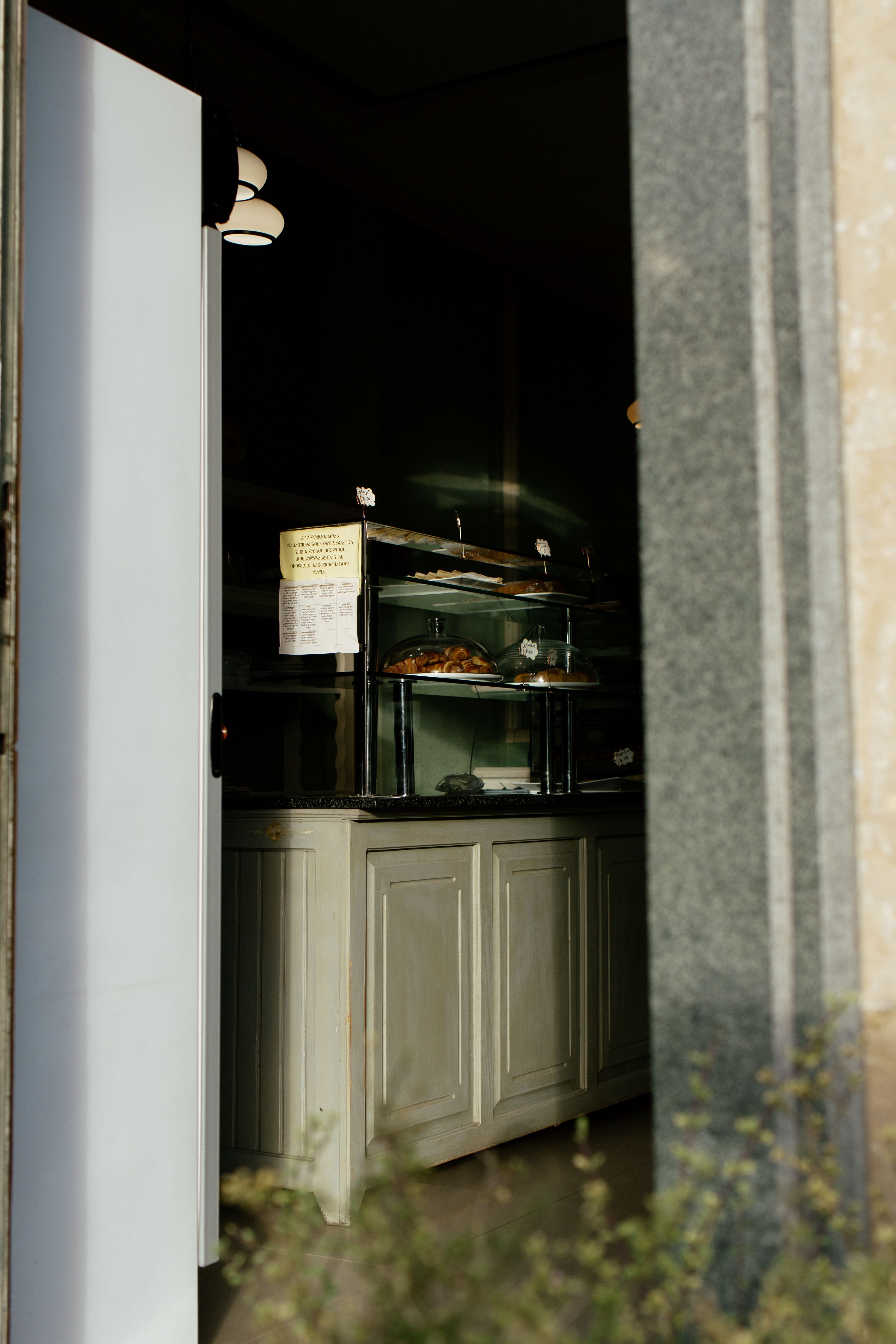 Kitchen Counter with Plates of Food seen through Cracked Doors · Free ...