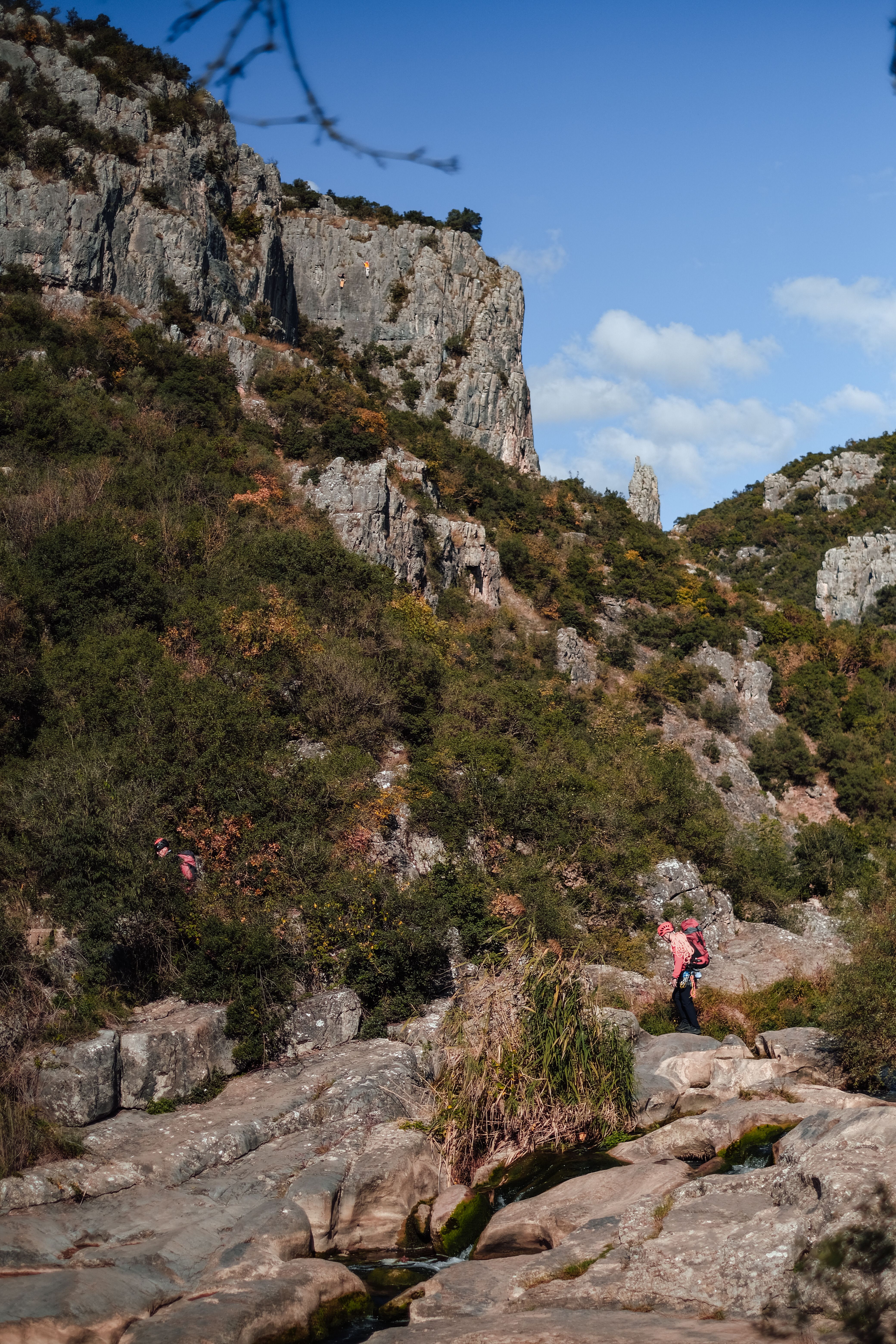 Man Hiking on Rocks in Mountains Landscape · Free Stock Photo