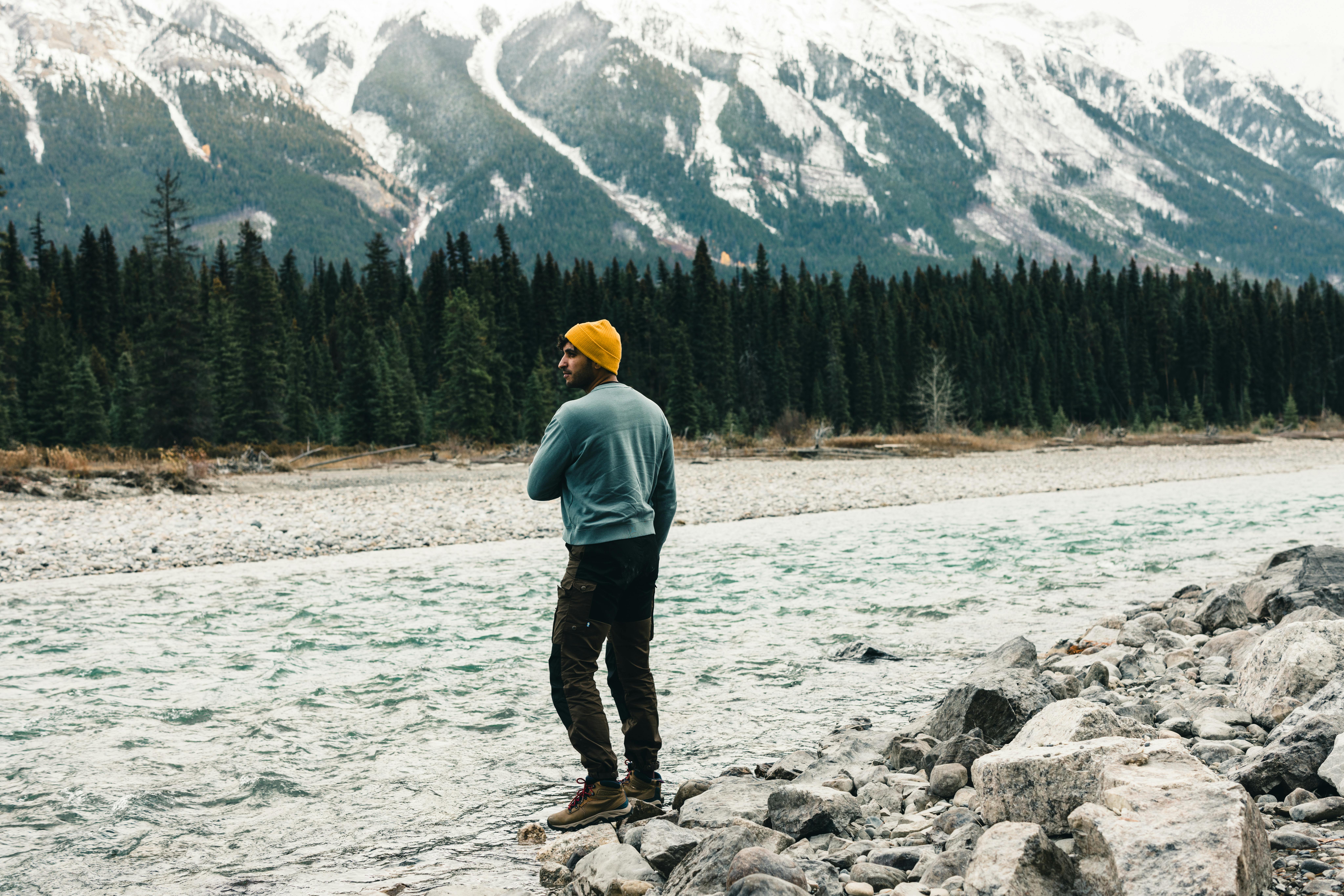 Man Standing near a River · Free Stock Photo