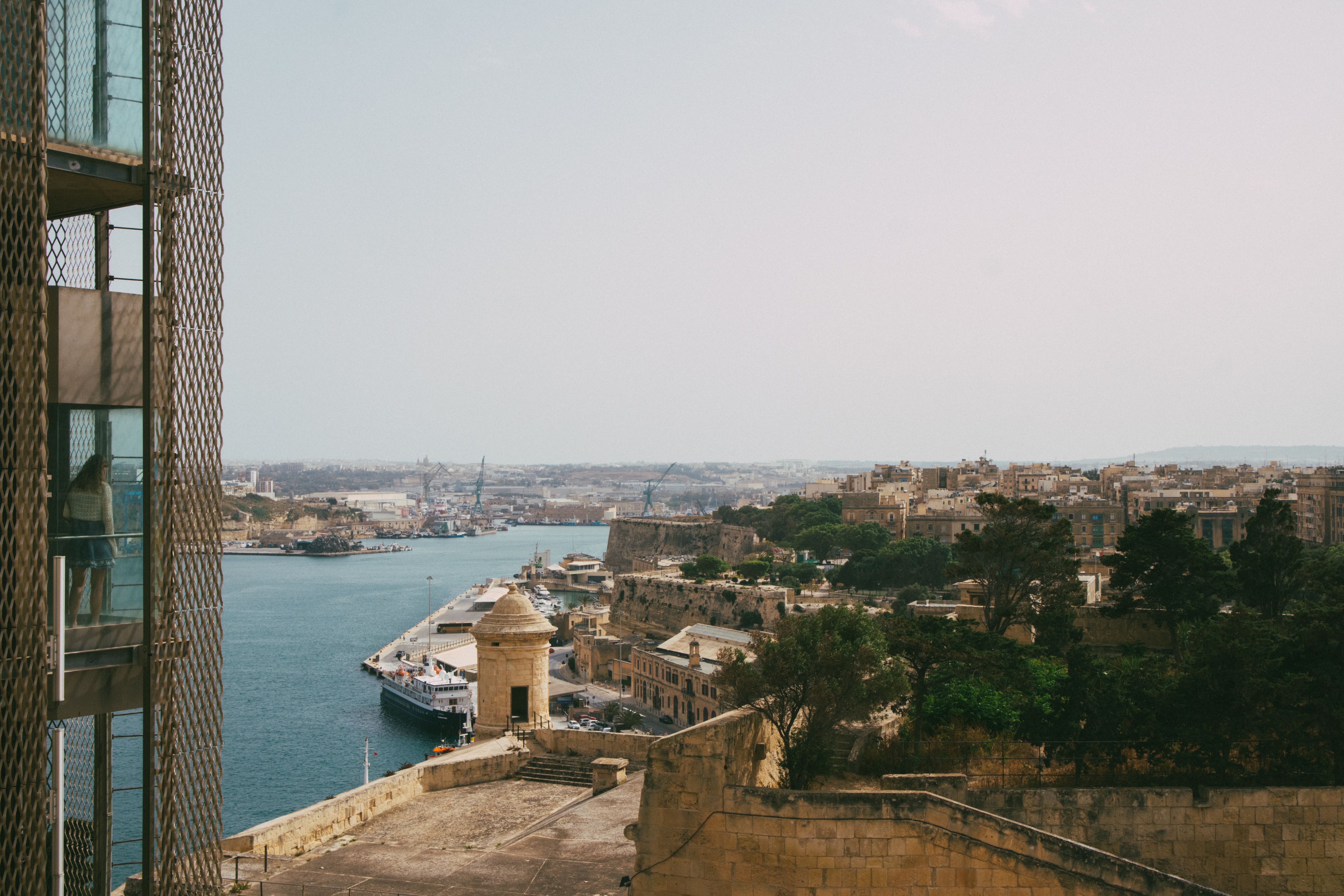 Concrete Building Near Body of Water · Free Stock Photo