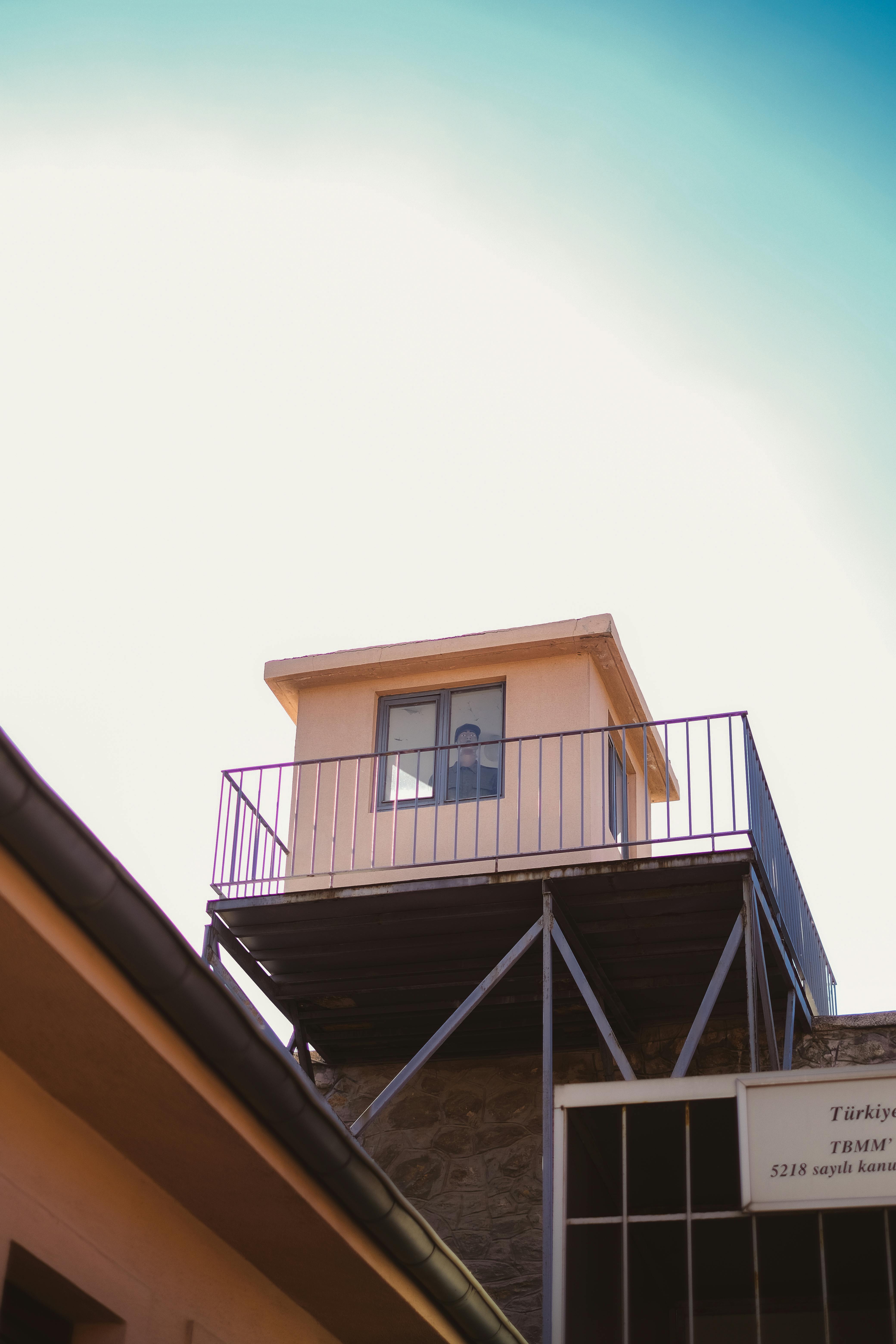 Person Standing Inside the Watchtower of a Building · Free Stock Photo