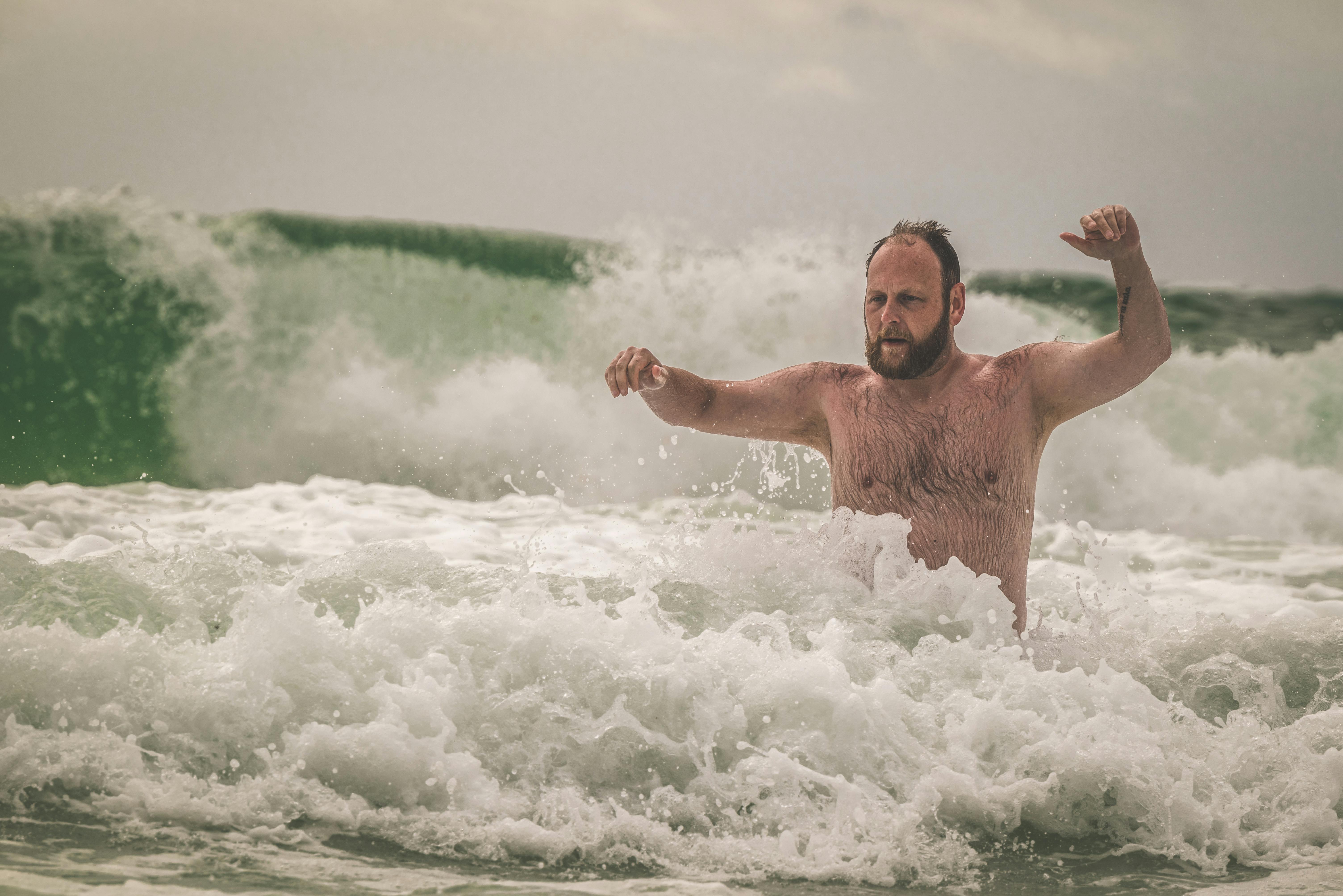 Shirtless Man Cooling Off with Water from a Bowl · Free Stock Photo