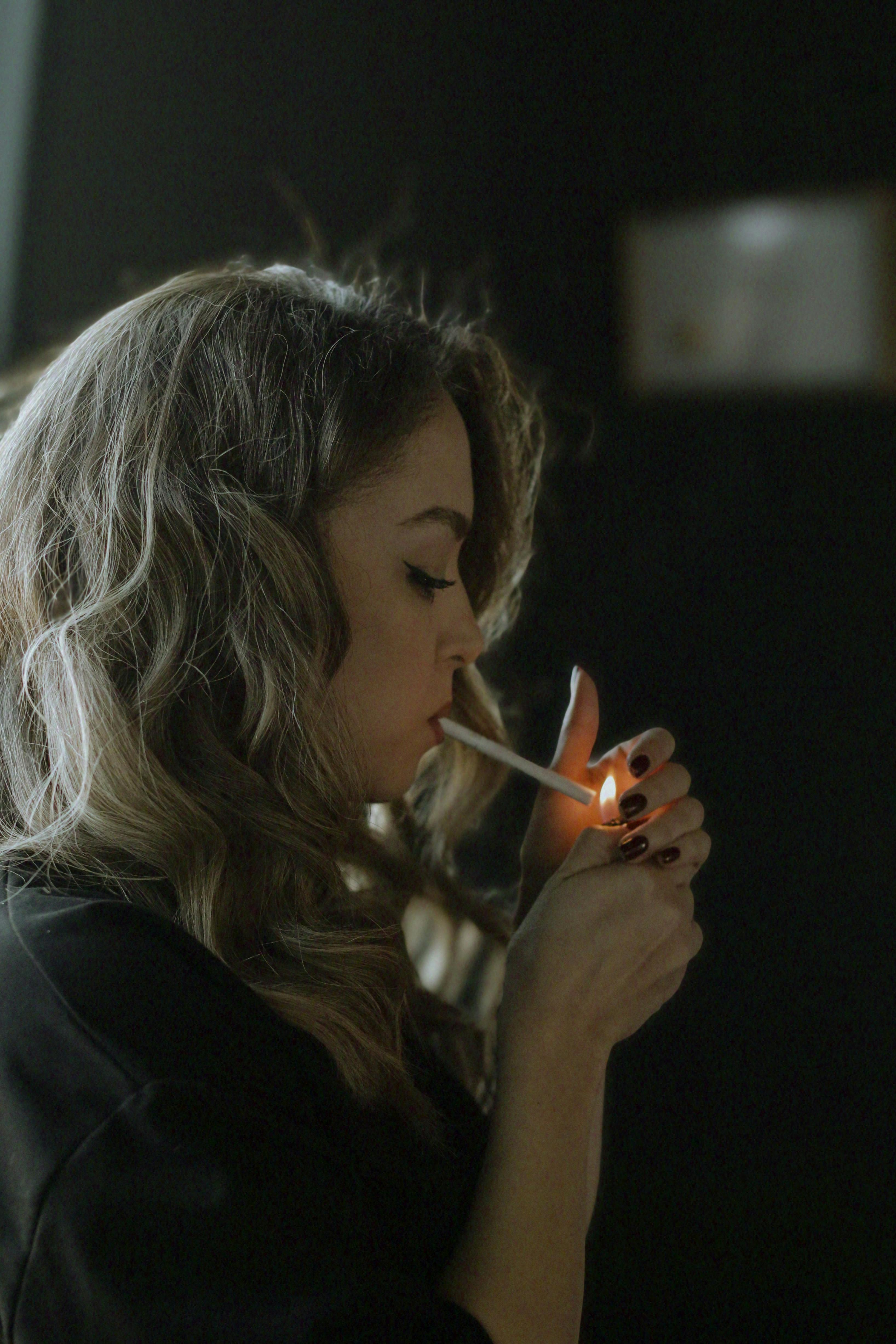 Woman Lighting up Cigarette · Free Stock Photo