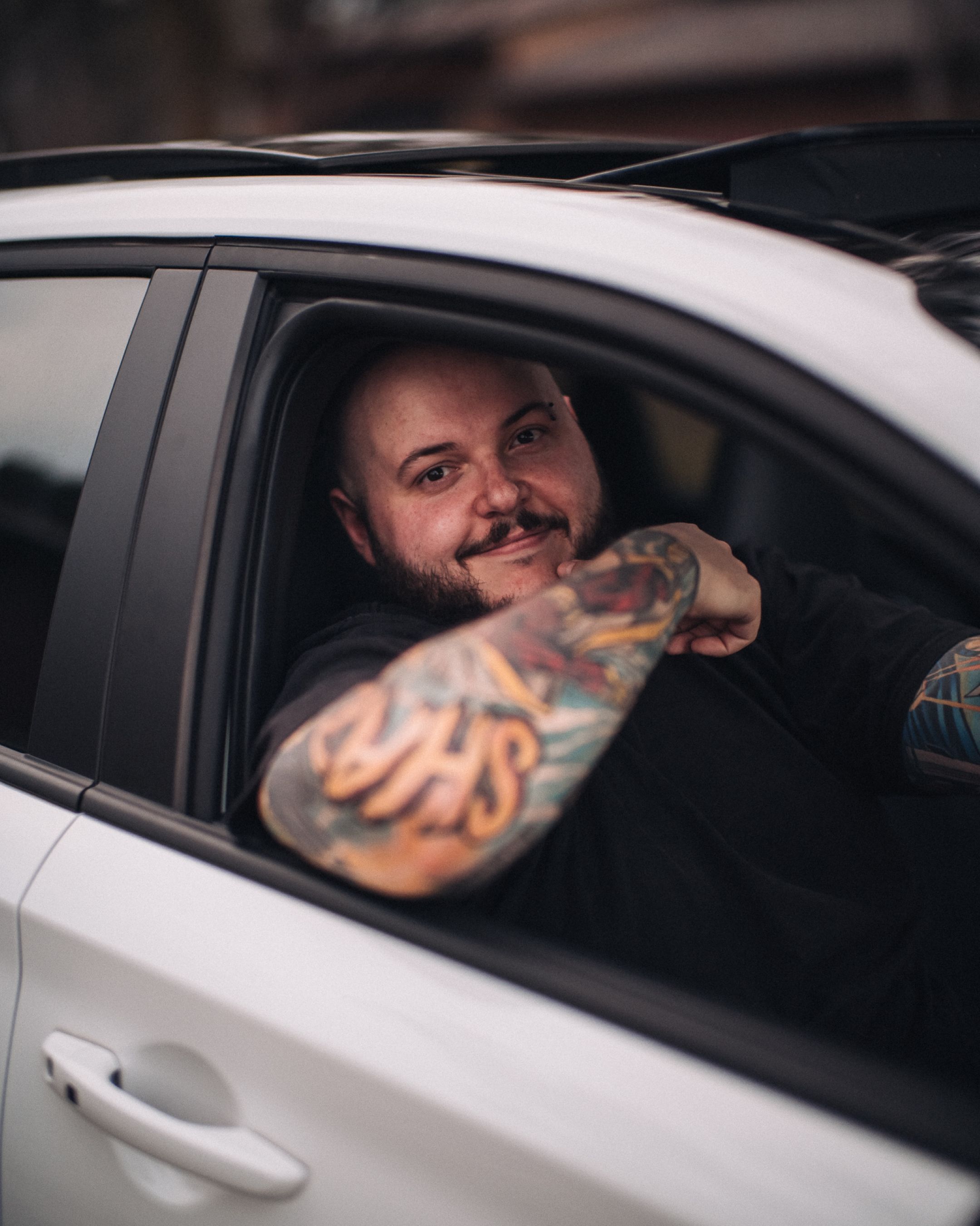 Tattooed Man inside the Car · Free Stock Photo
