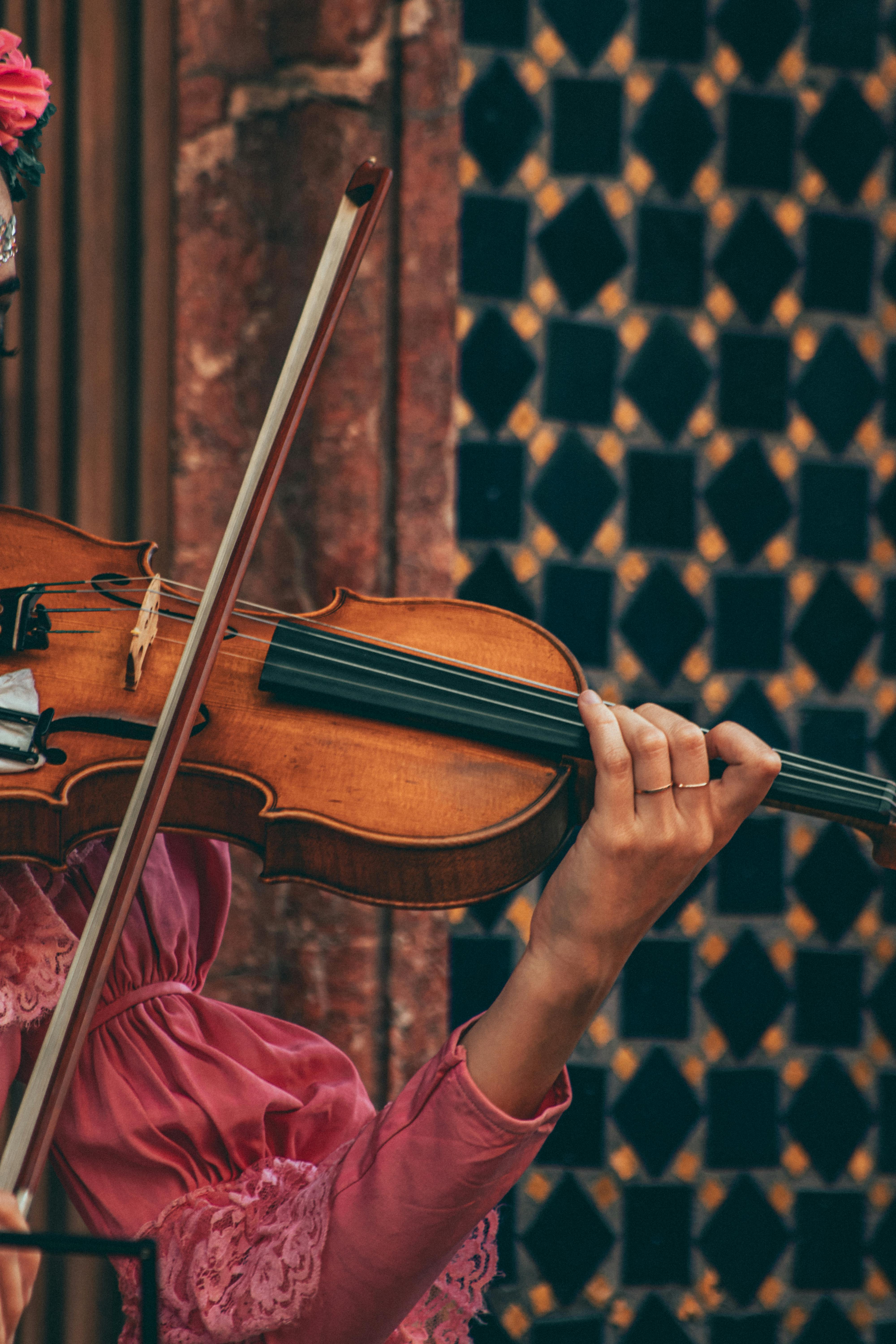 Close-Up Shot of a Person Playing Violin · Free Stock Photo