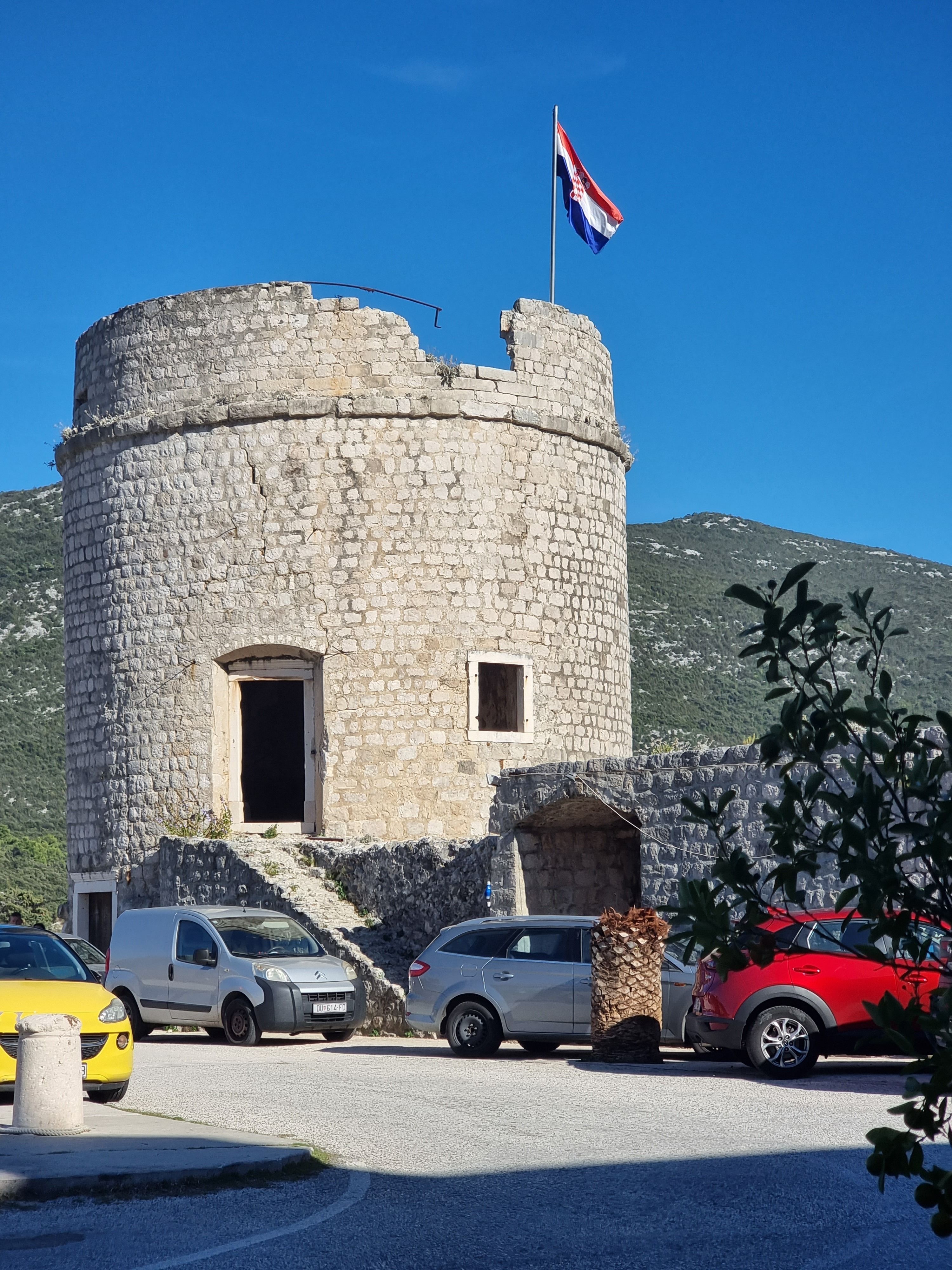 Parked Cars Near Toljevac Tower · Free Stock Photo
