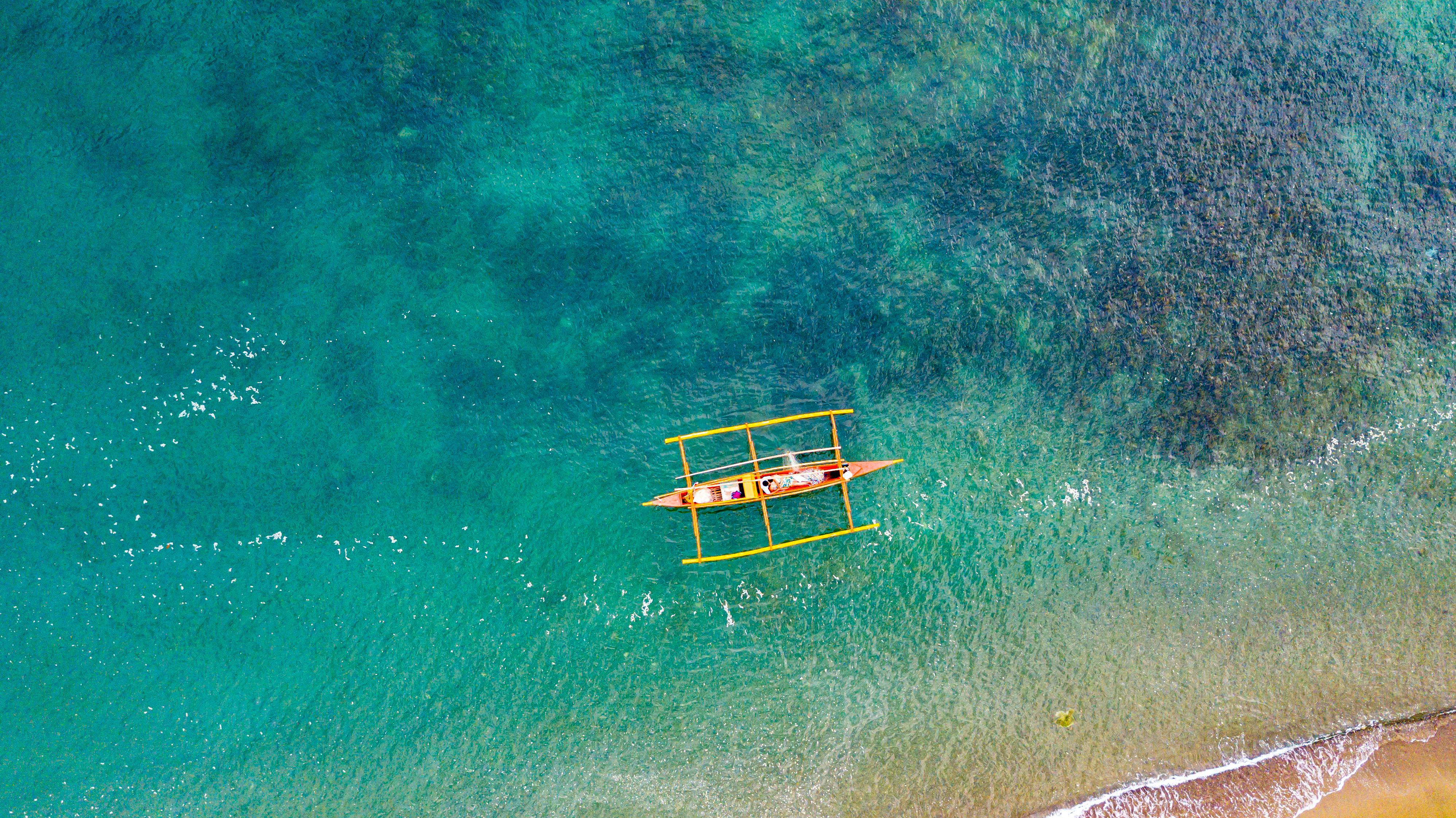 Drone Shot of a Boat near Shore · Free Stock Photo