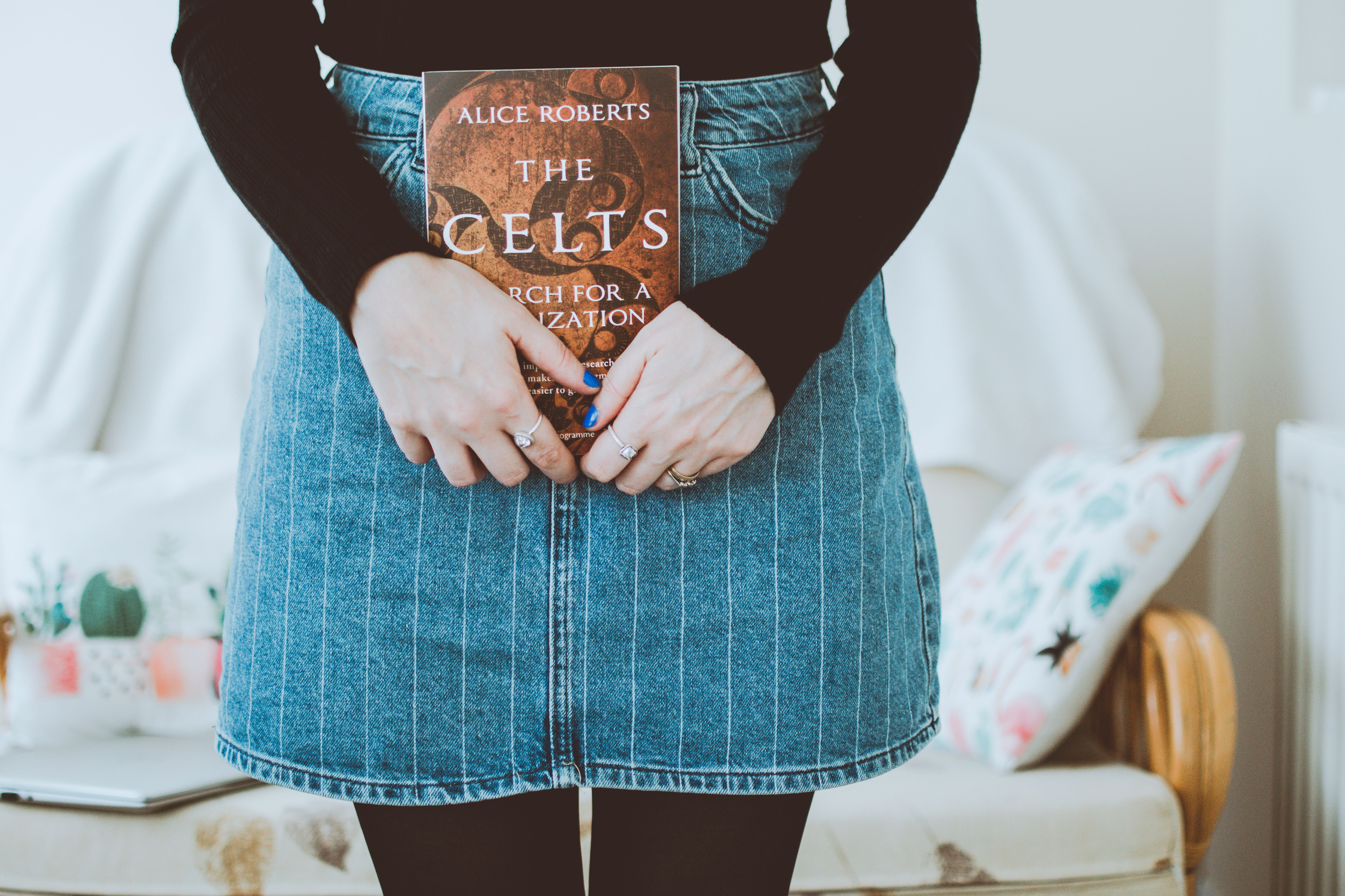 Woman Holding Book With Two Hands · Free Stock Photo