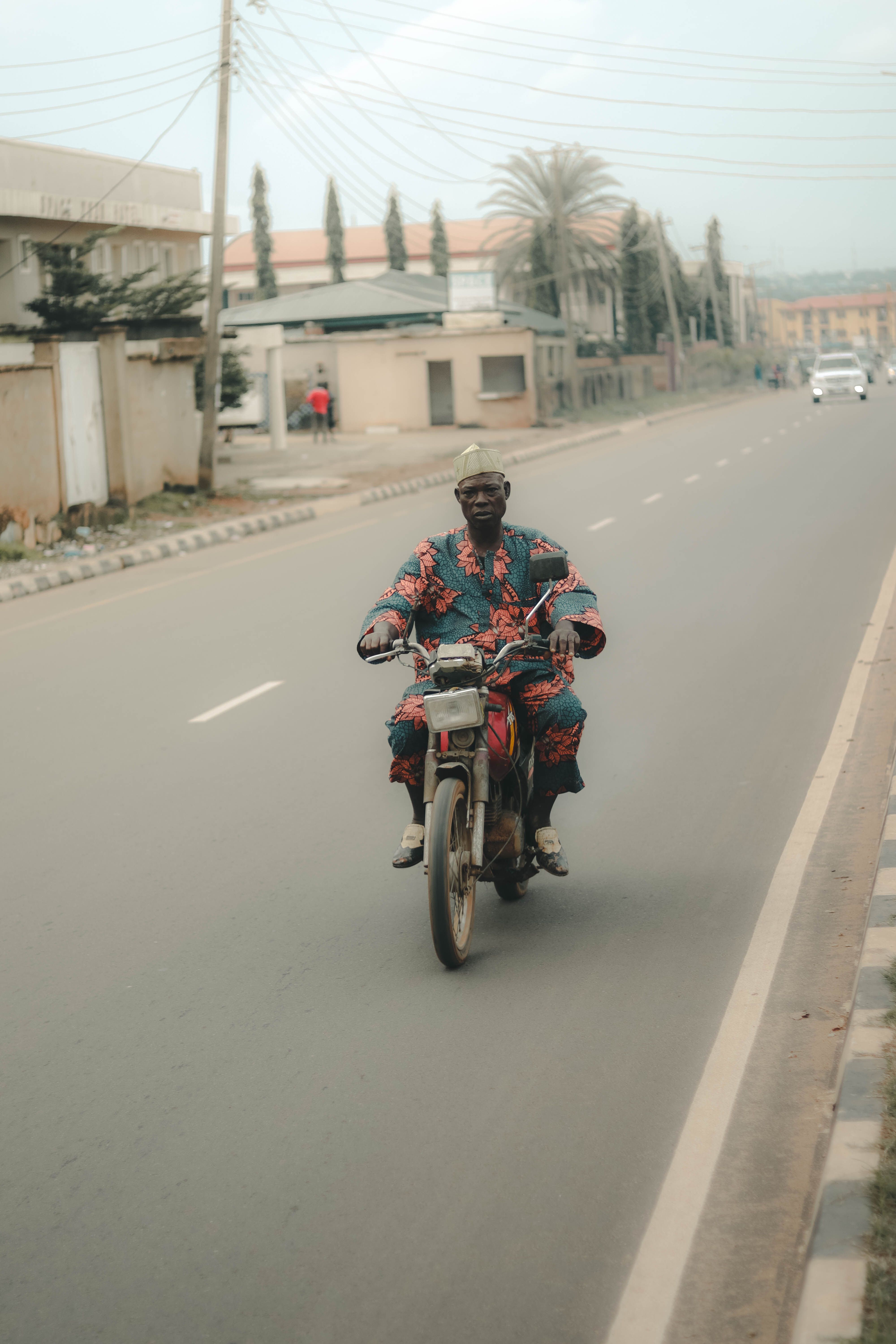 A Man Riding a Motorcycle on the Road · Free Stock Photo