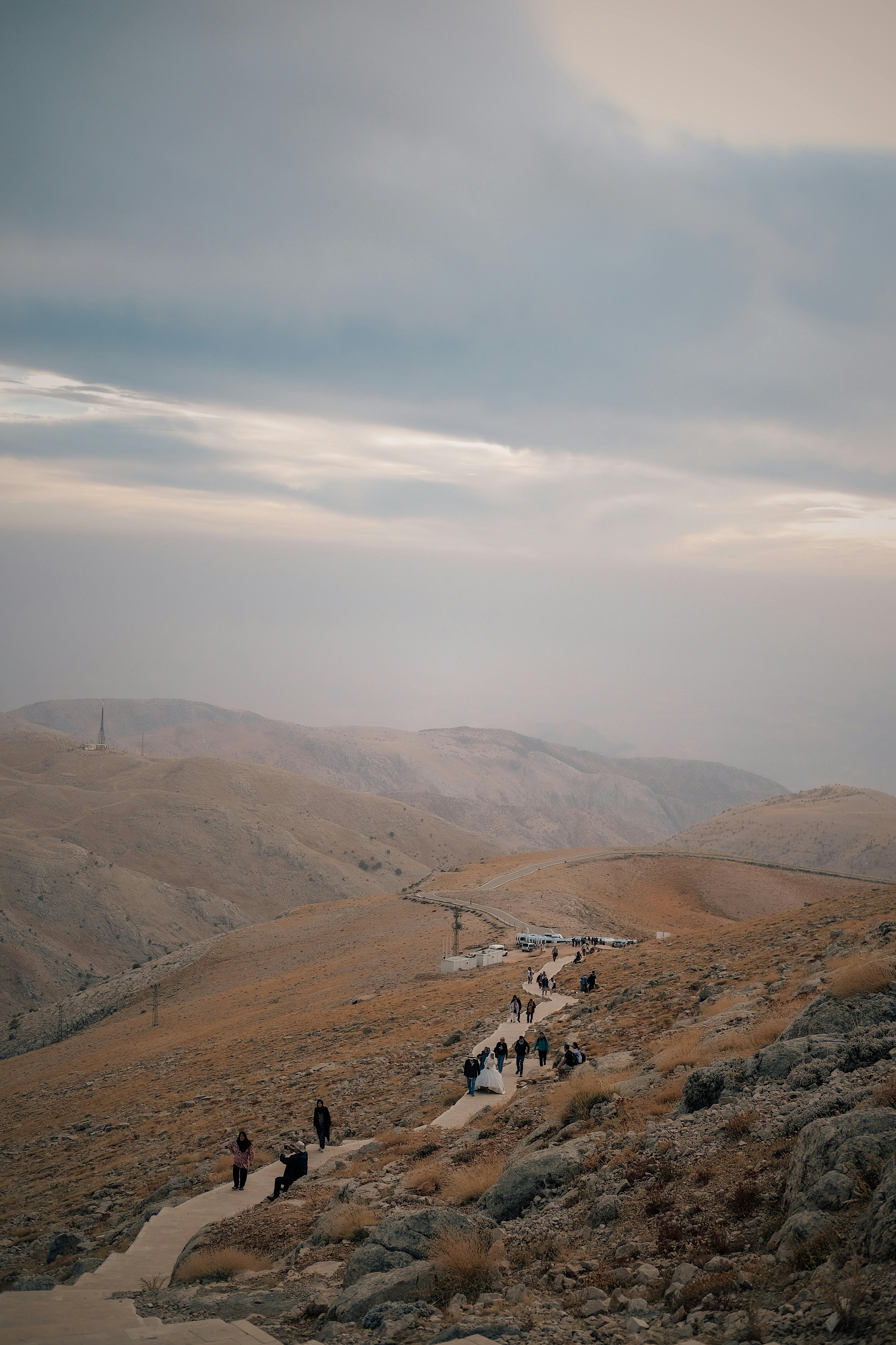 People Walking on Hill Pathway · Free Stock Photo