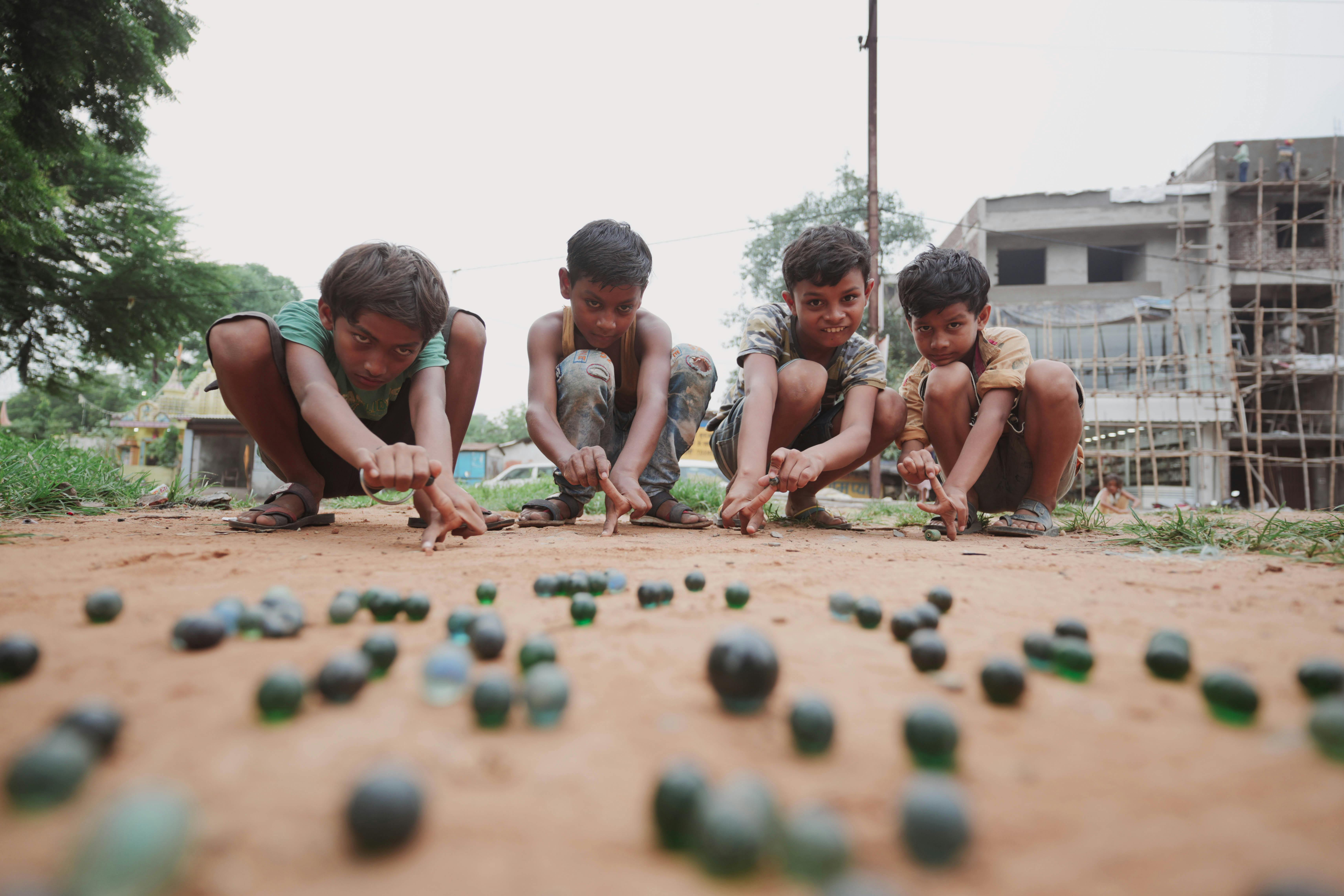 Children Playing on Brown Field · Free Stock Photo