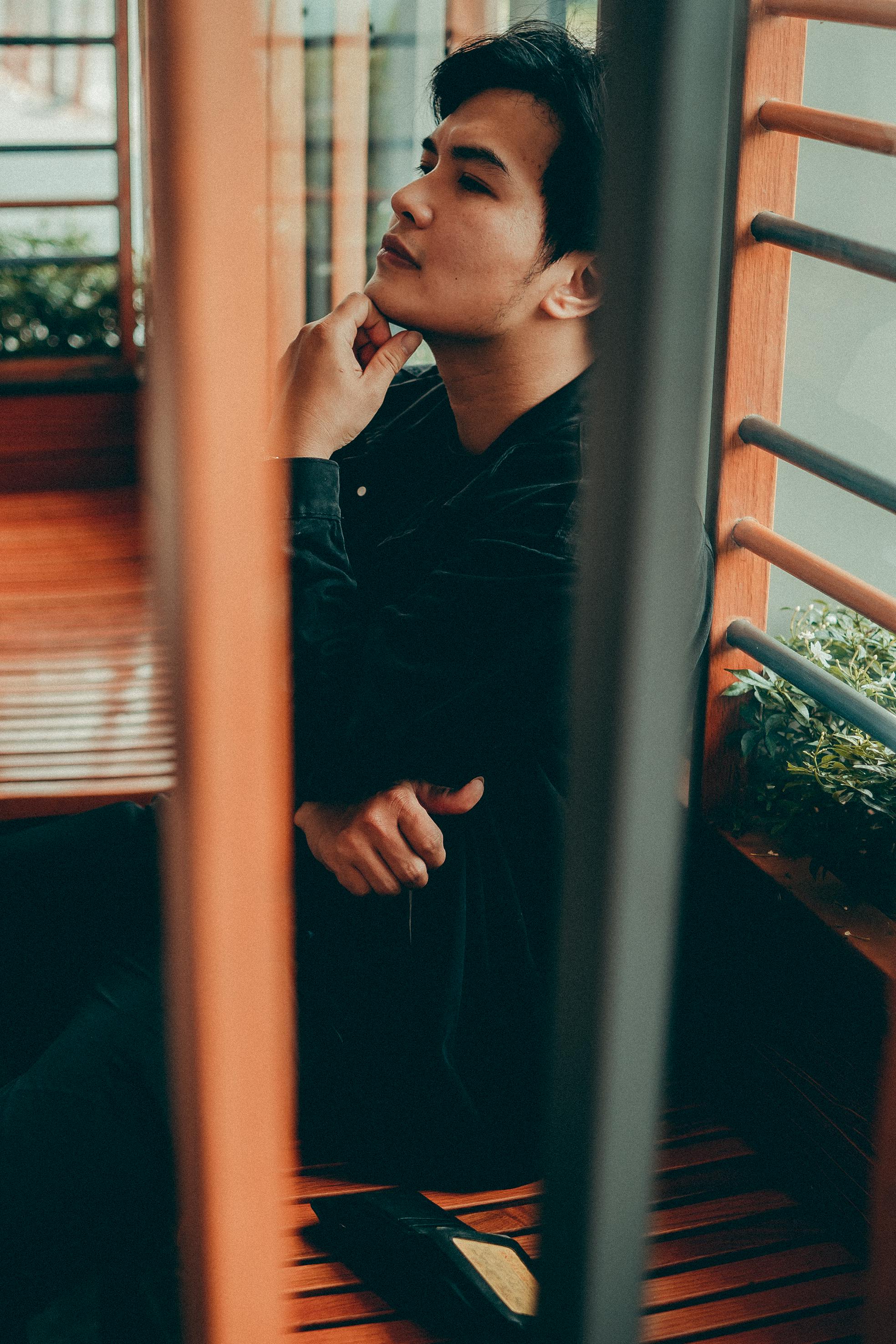 A Man in Black Jacket with His Hand on His Chin · Free Stock Photo