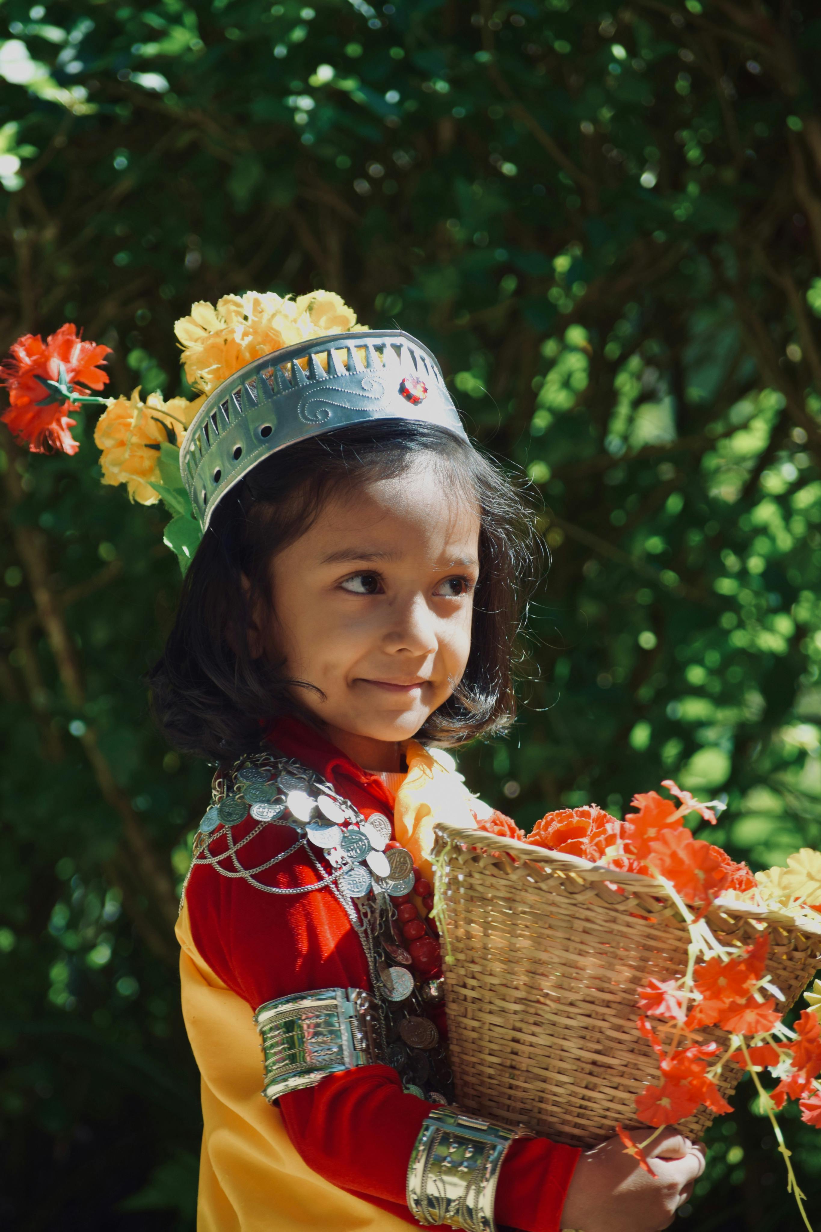 A Cute Girl in a Queen Costume Holding a Star Wand · Free Stock Photo