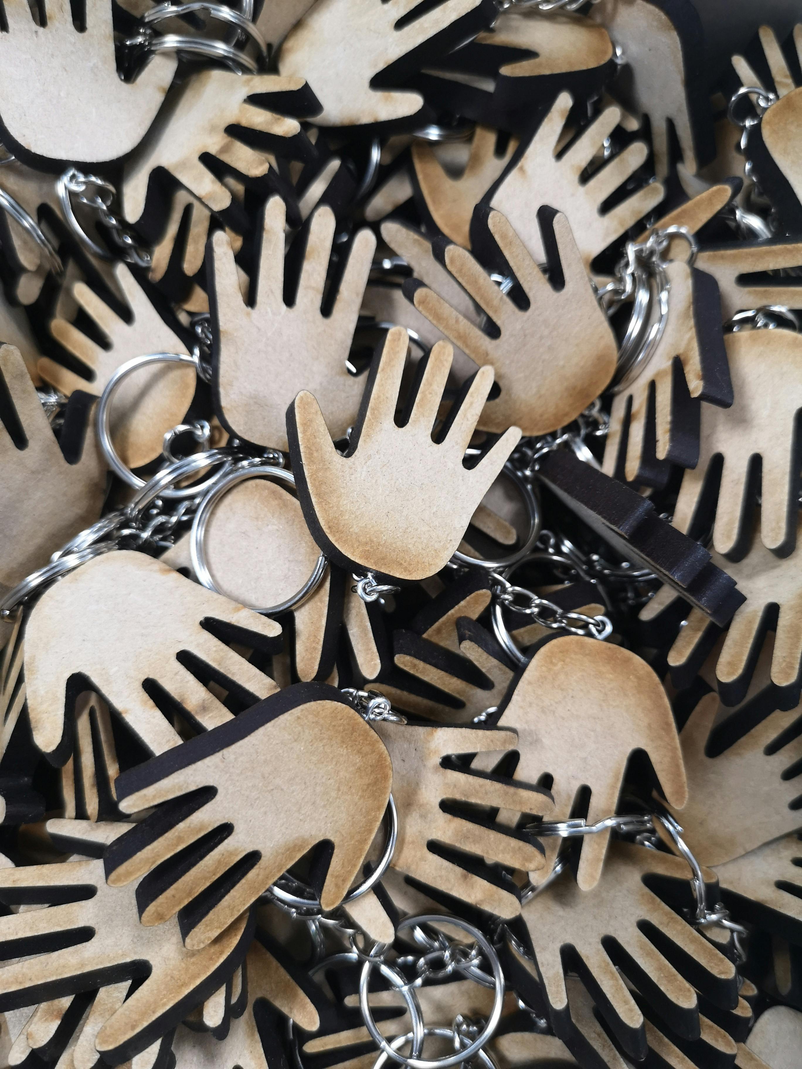 Photo of a Pile of Hand Shaped Keychains · Free Stock Photo