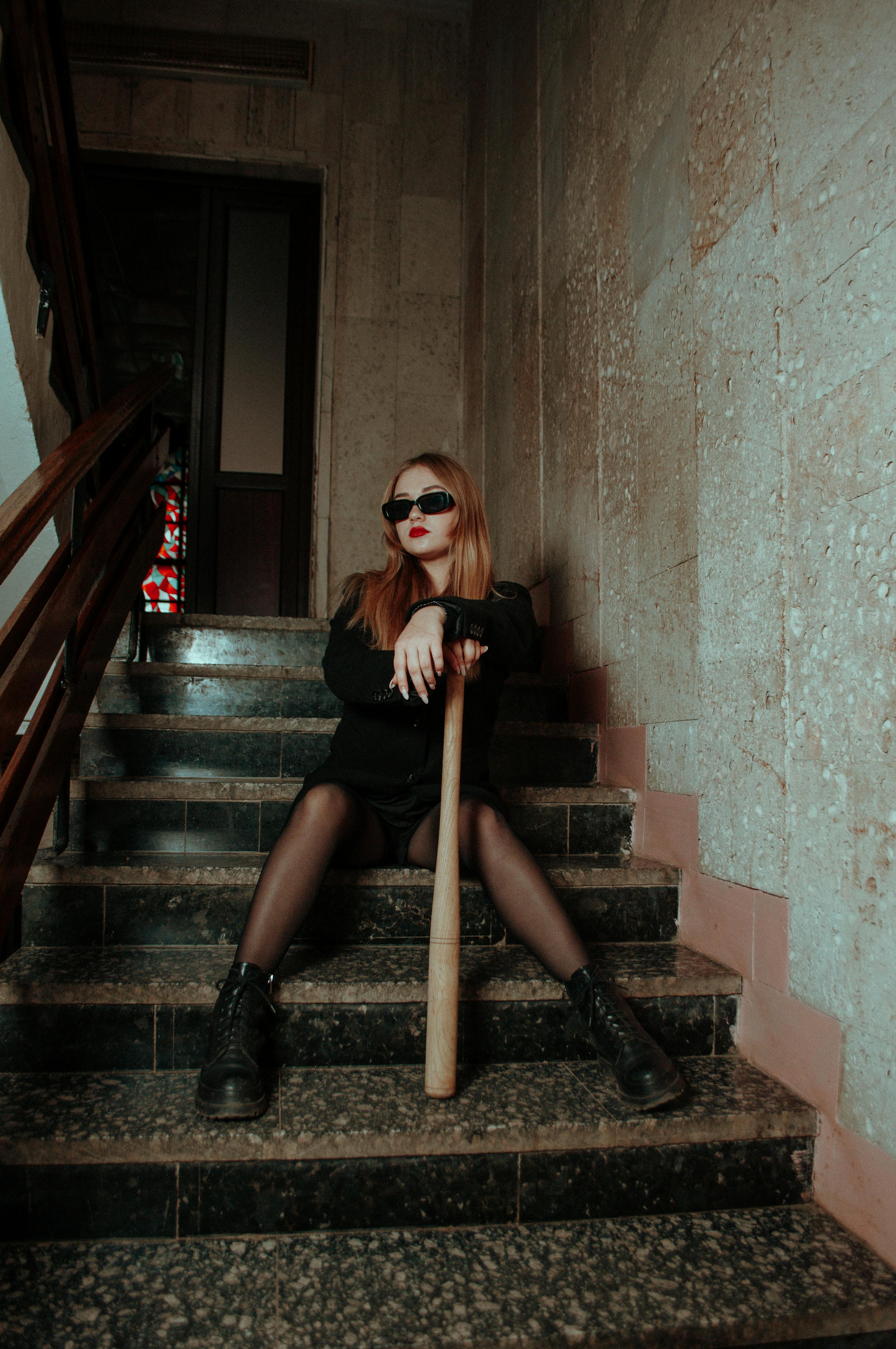 A Woman Holding a Baseball Bat · Free Stock Photo