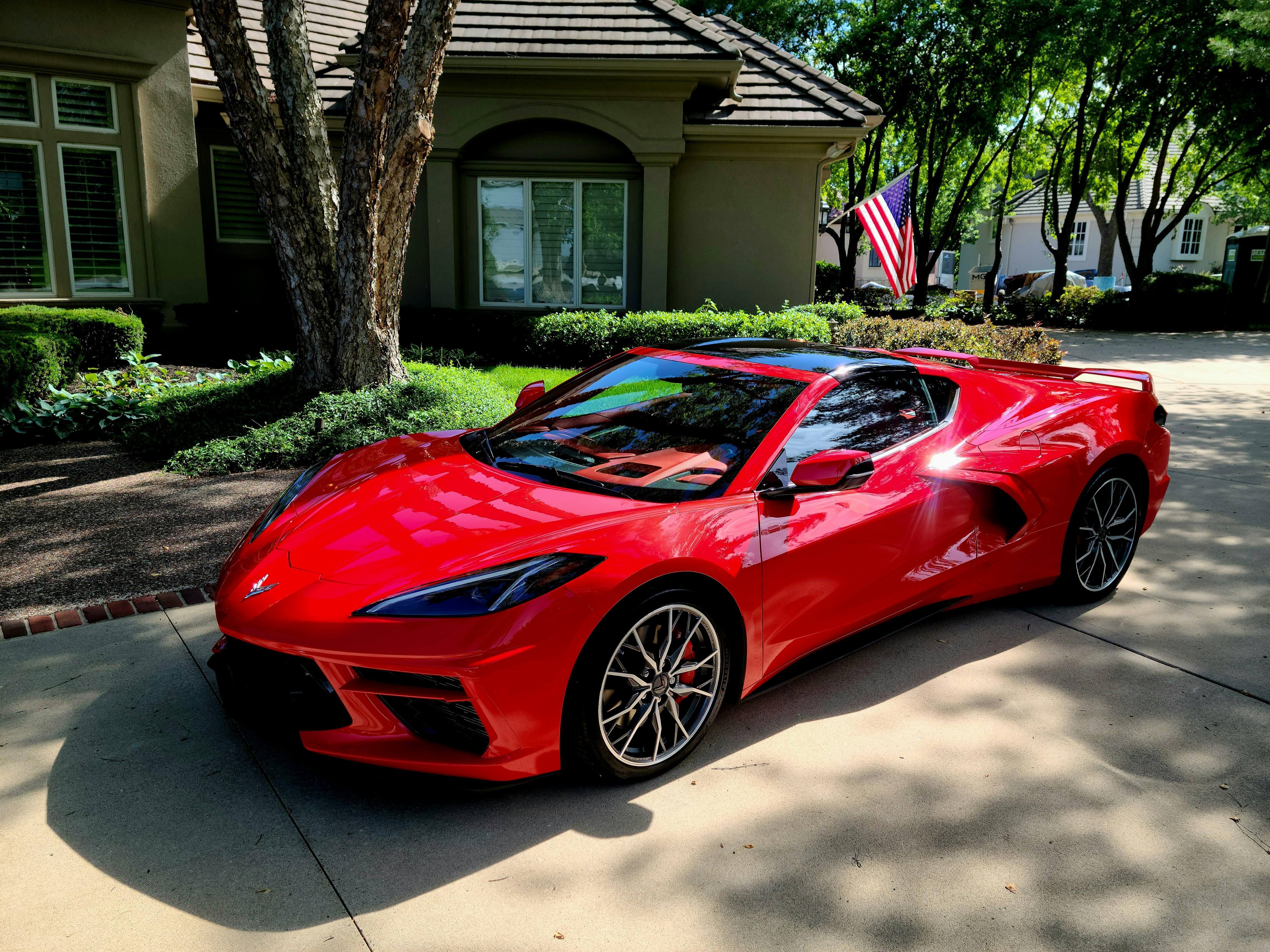 Sports Car Parked in front of House · Free Stock Photo
