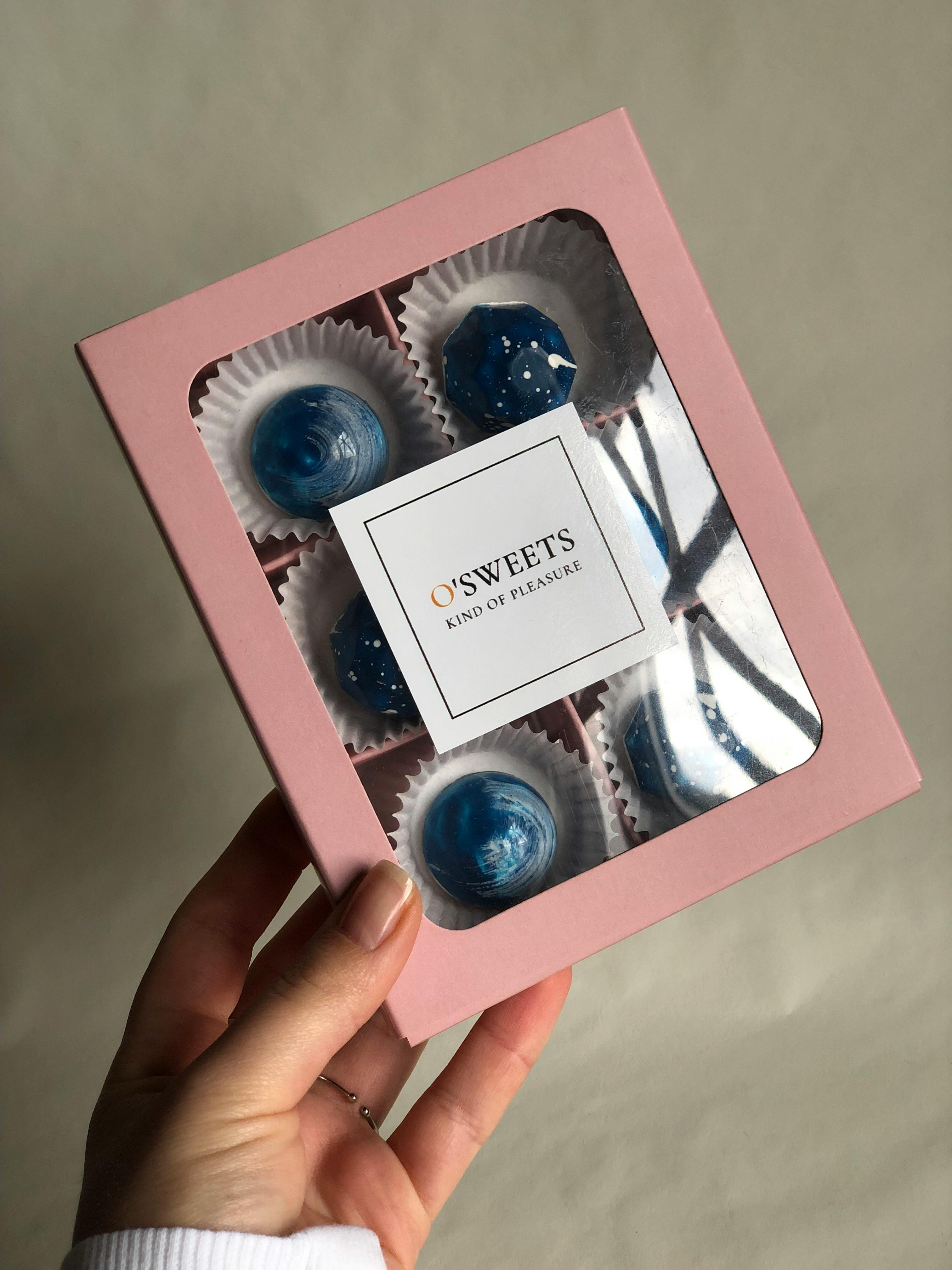 Person Holding a Box of Sweets · Free Stock Photo