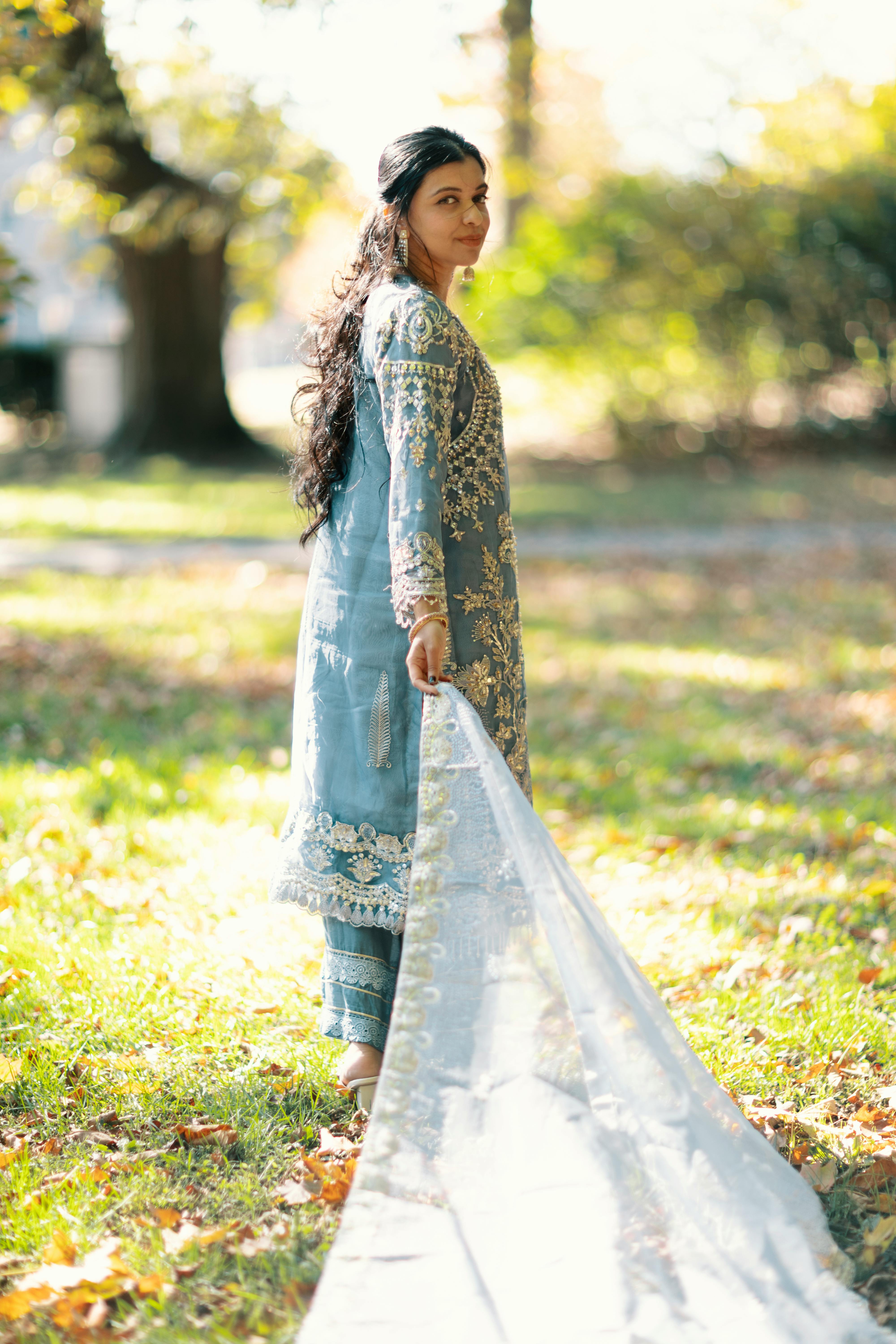 Women in Traditional Bright Colored Cloak · Free Stock Photo