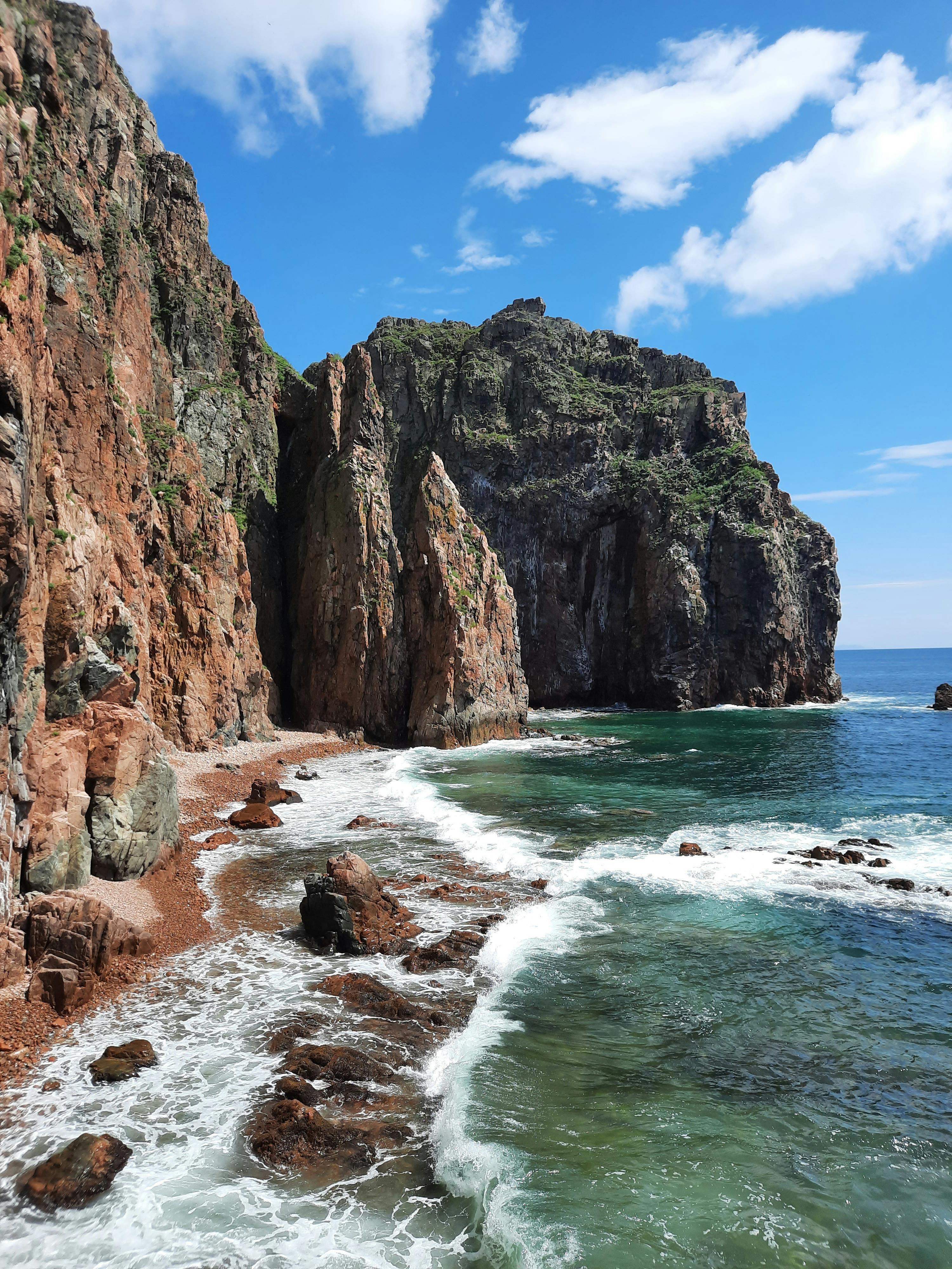 Cliff Rocks on Ocean Shore · Free Stock Photo