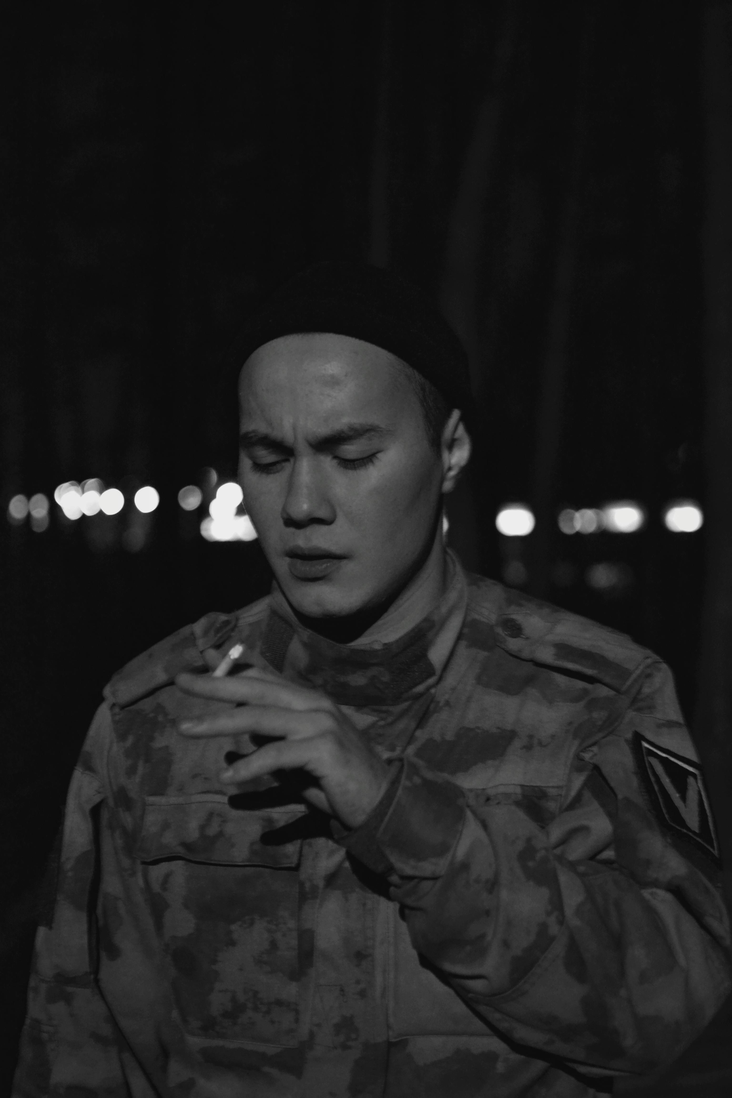 Man in Uniform Smoking · Free Stock Photo