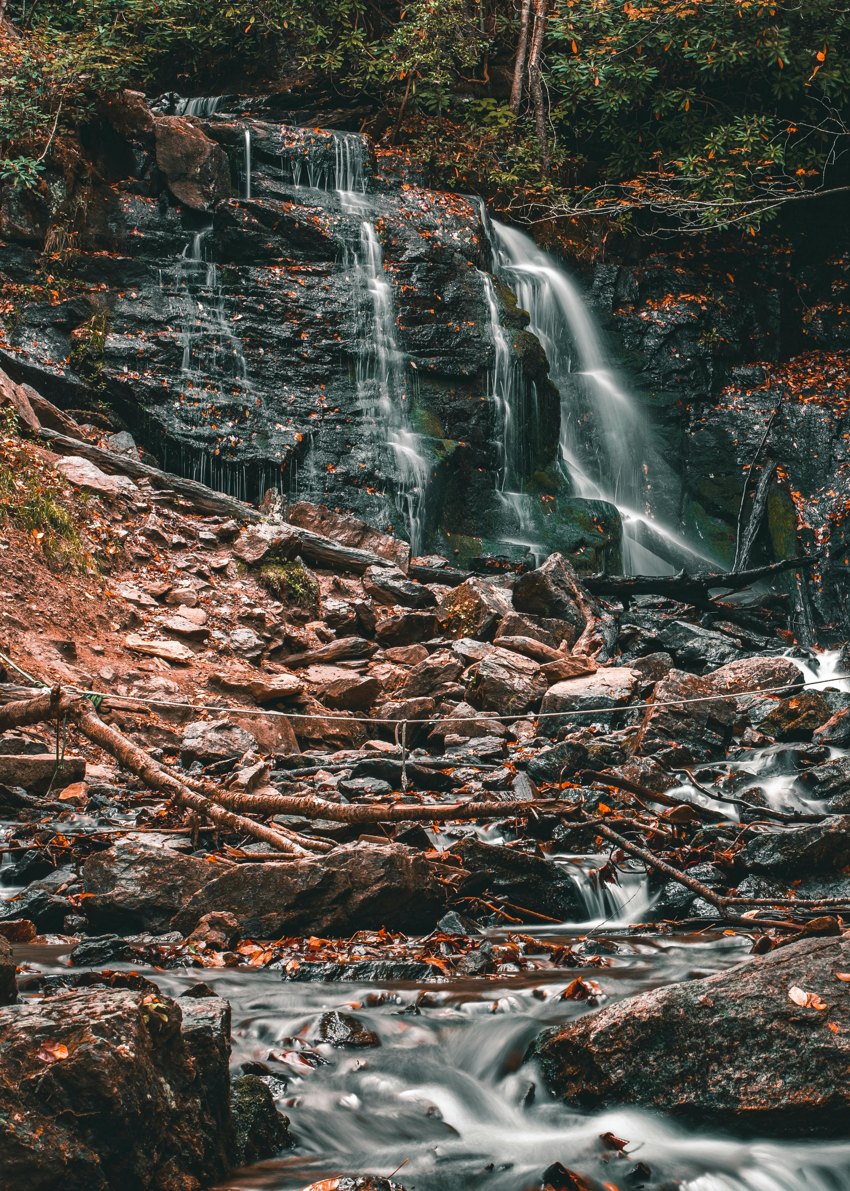 Waterfall Cascading over Cliff Rocks · Free Stock Photo