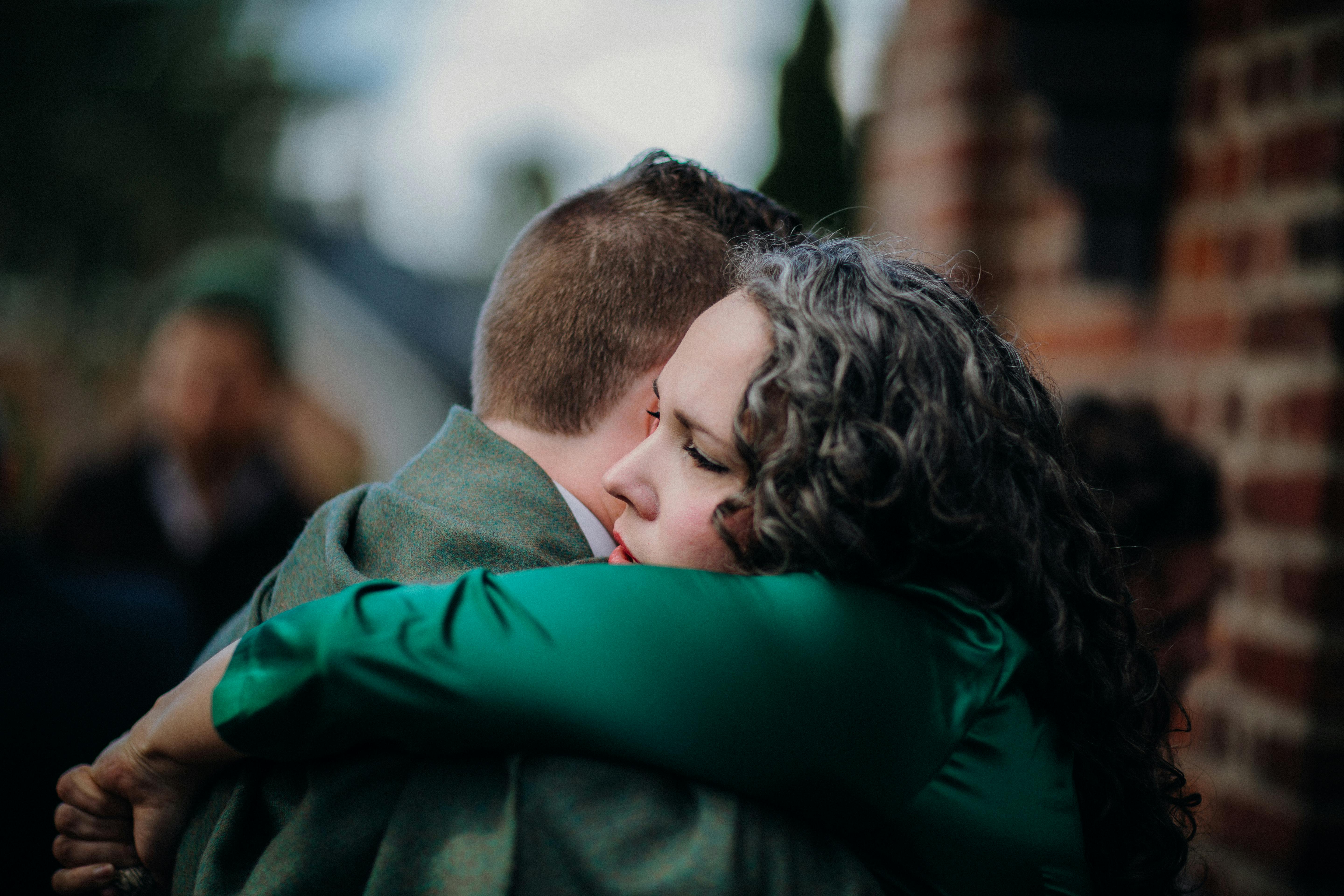 A Man Hugging a Woman · Free Stock Photo