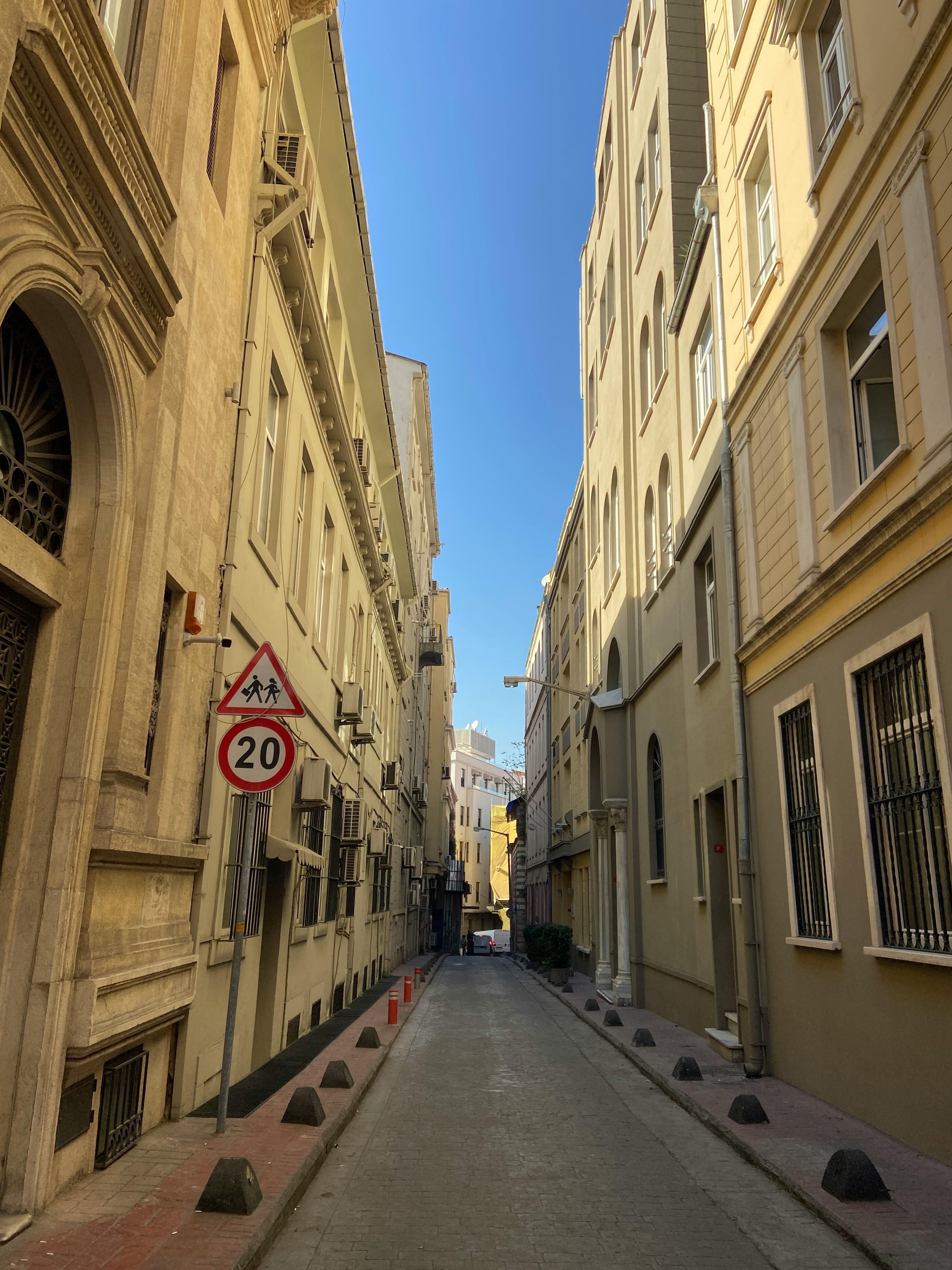 A Narrow Alley Between Concrete Buildings · Free Stock Photo