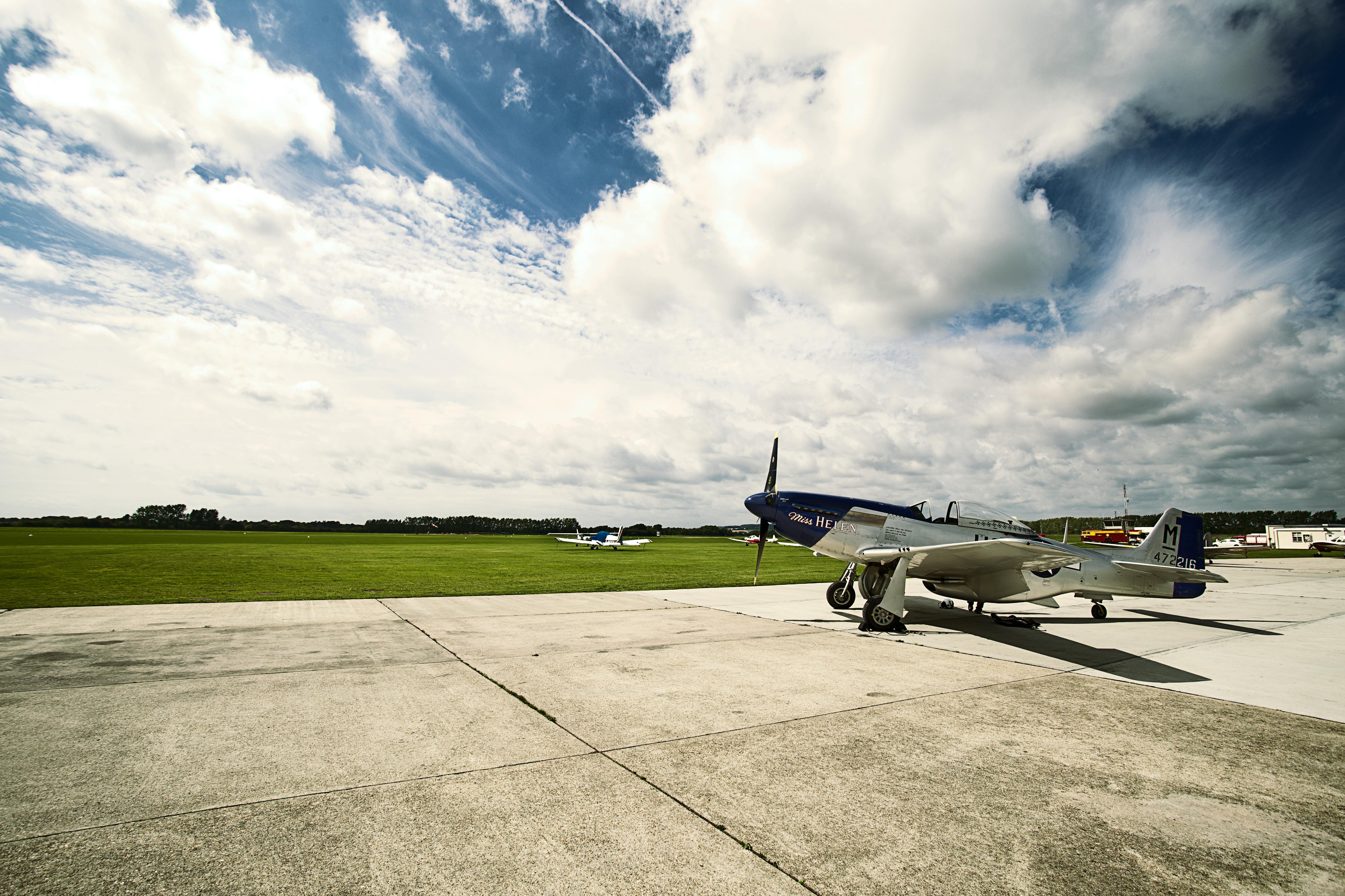 Photo of Airplane on Road Near Grass Field · Free Stock Photo