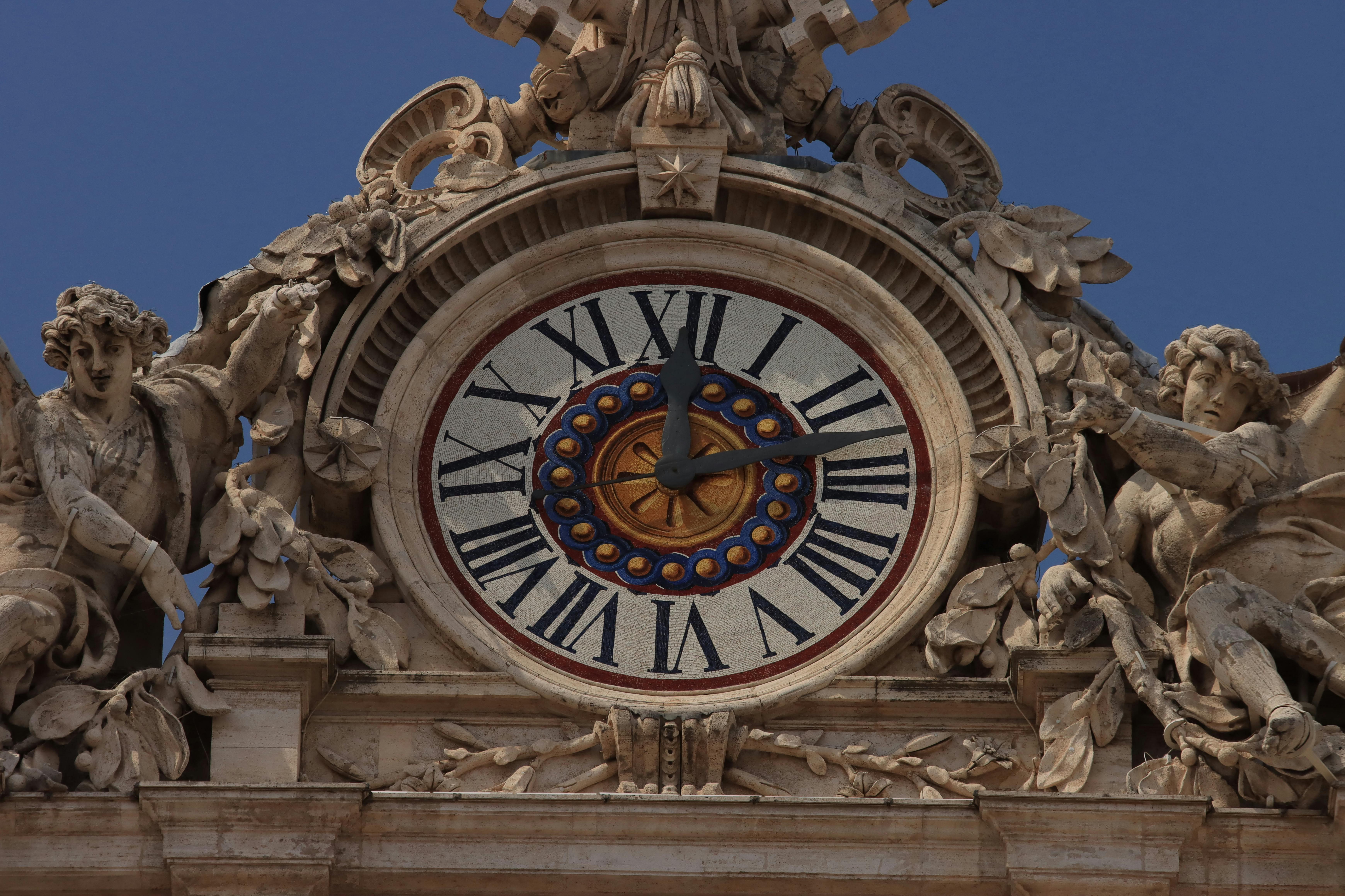 Clock of the St. Peters Basilica in Vatican City · Free Stock Photo