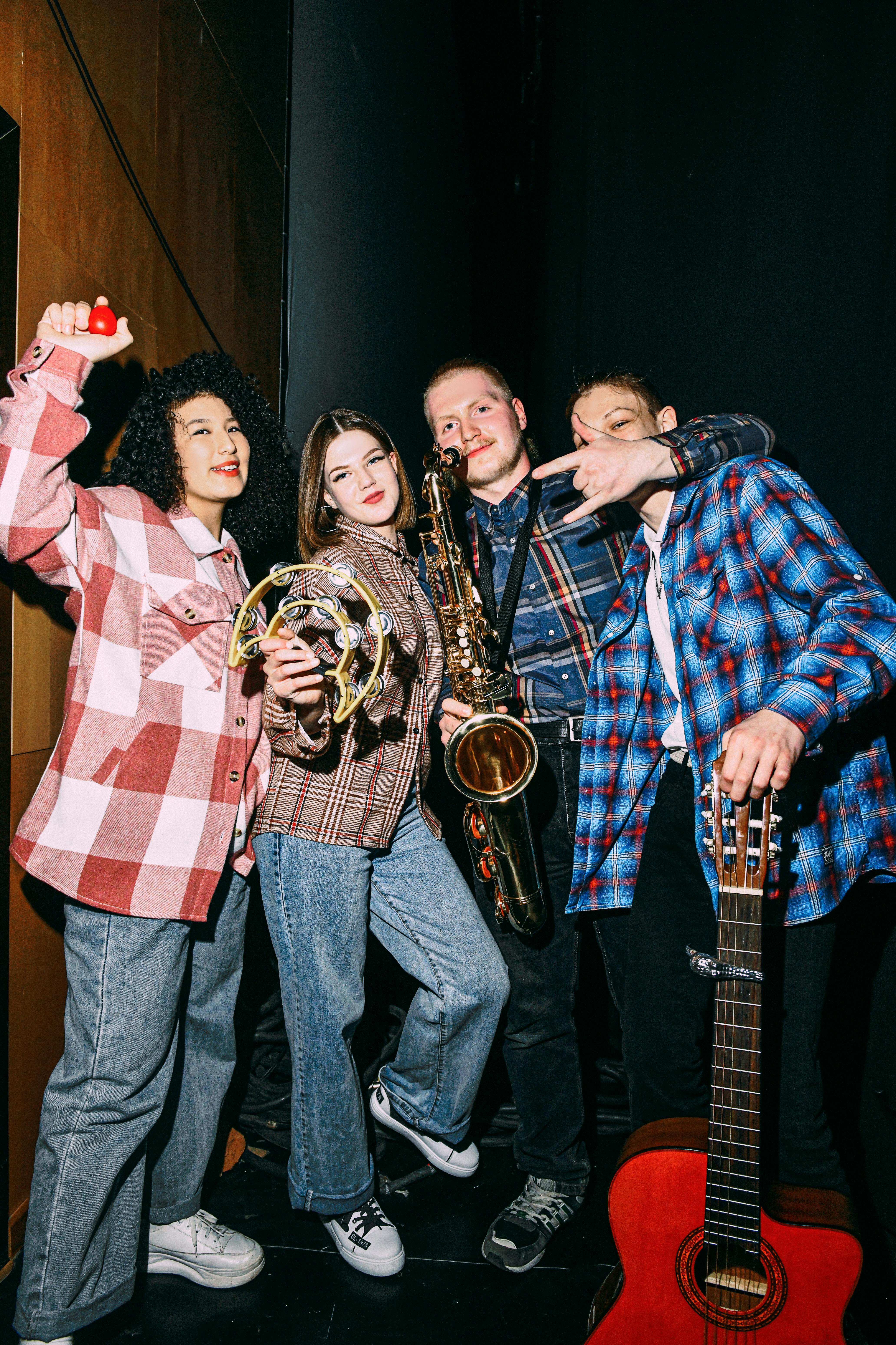 Group of Friends with Music Instruments · Free Stock Photo