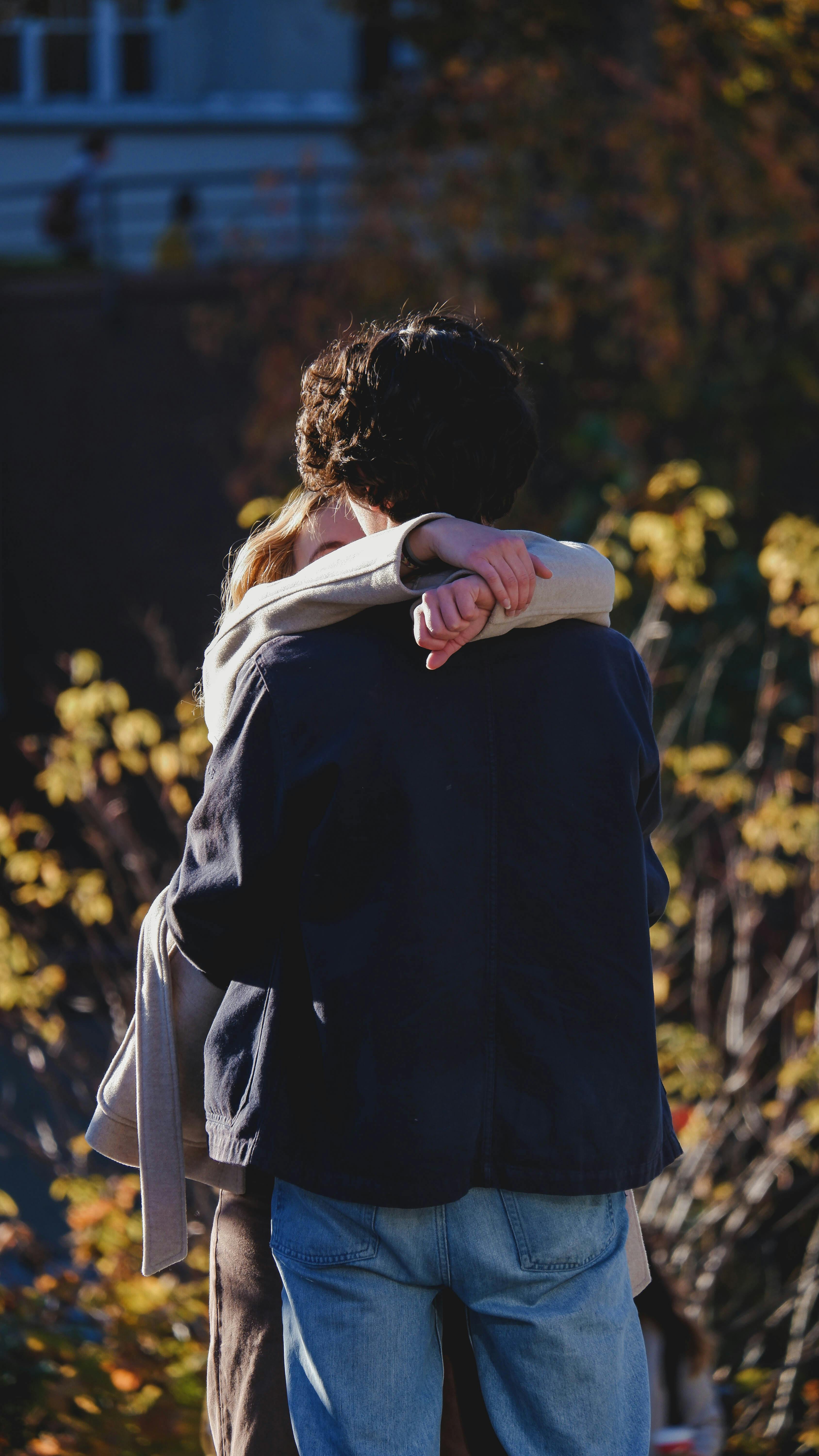 A Tattooed Couple Hugging Each Other · Free Stock Photo