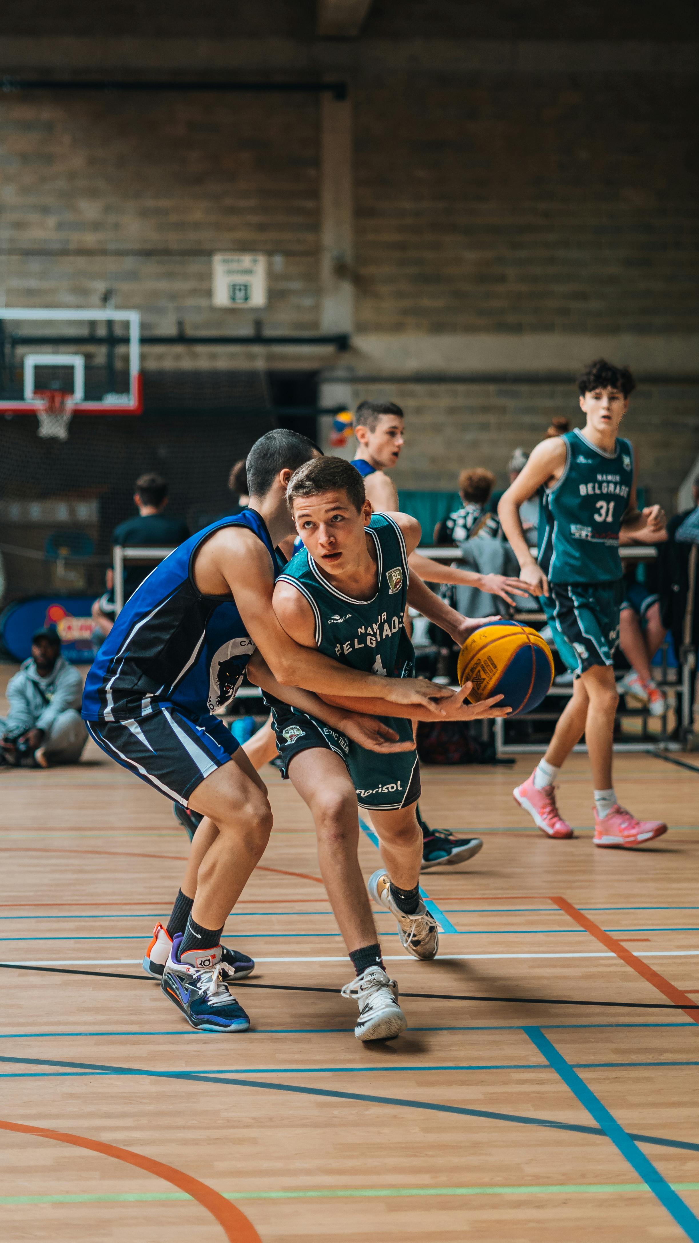 Basketball Players Playing in the Court · Free Stock Photo