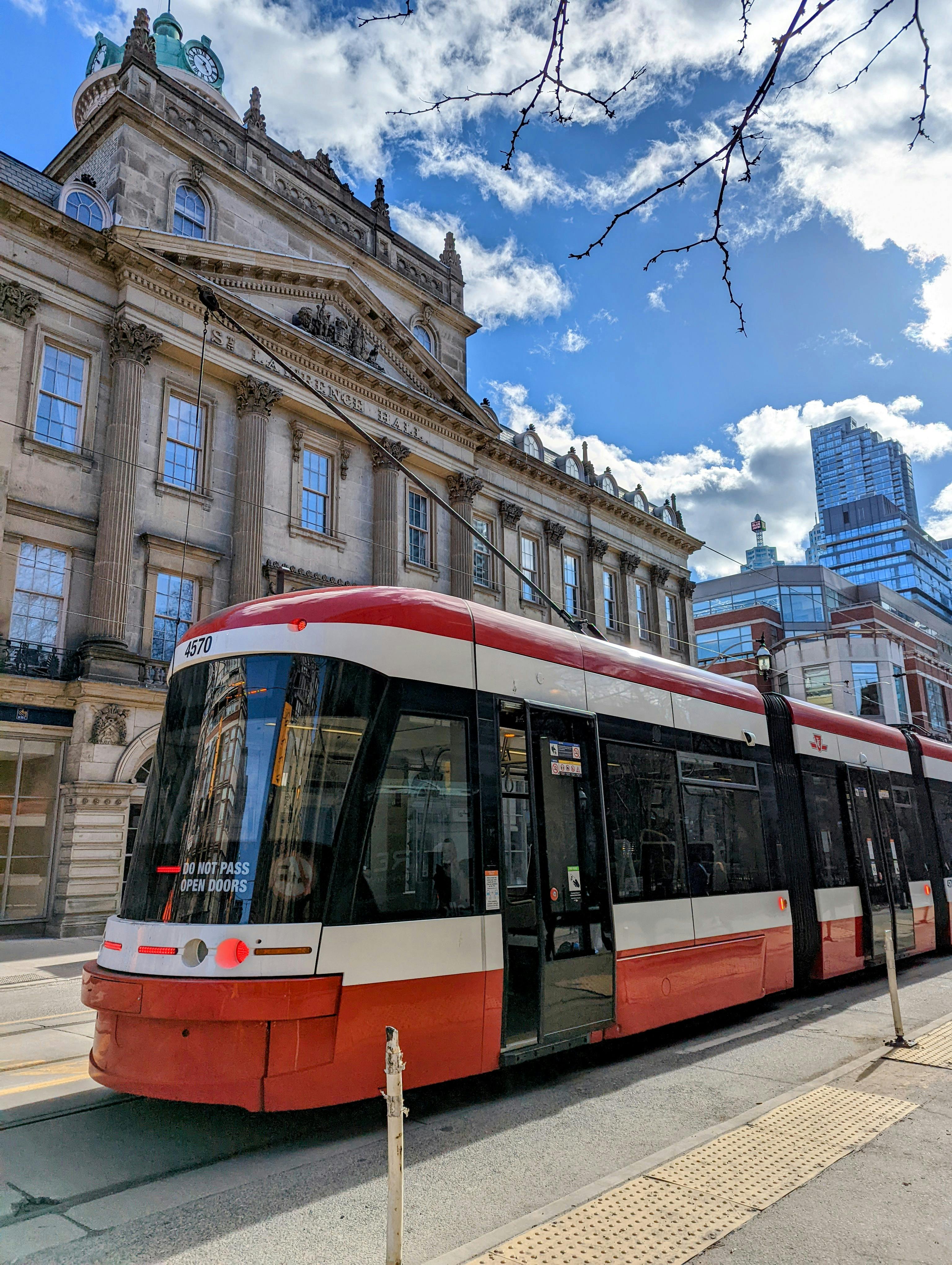 Red and White Tram on the Street · Free Stock Photo