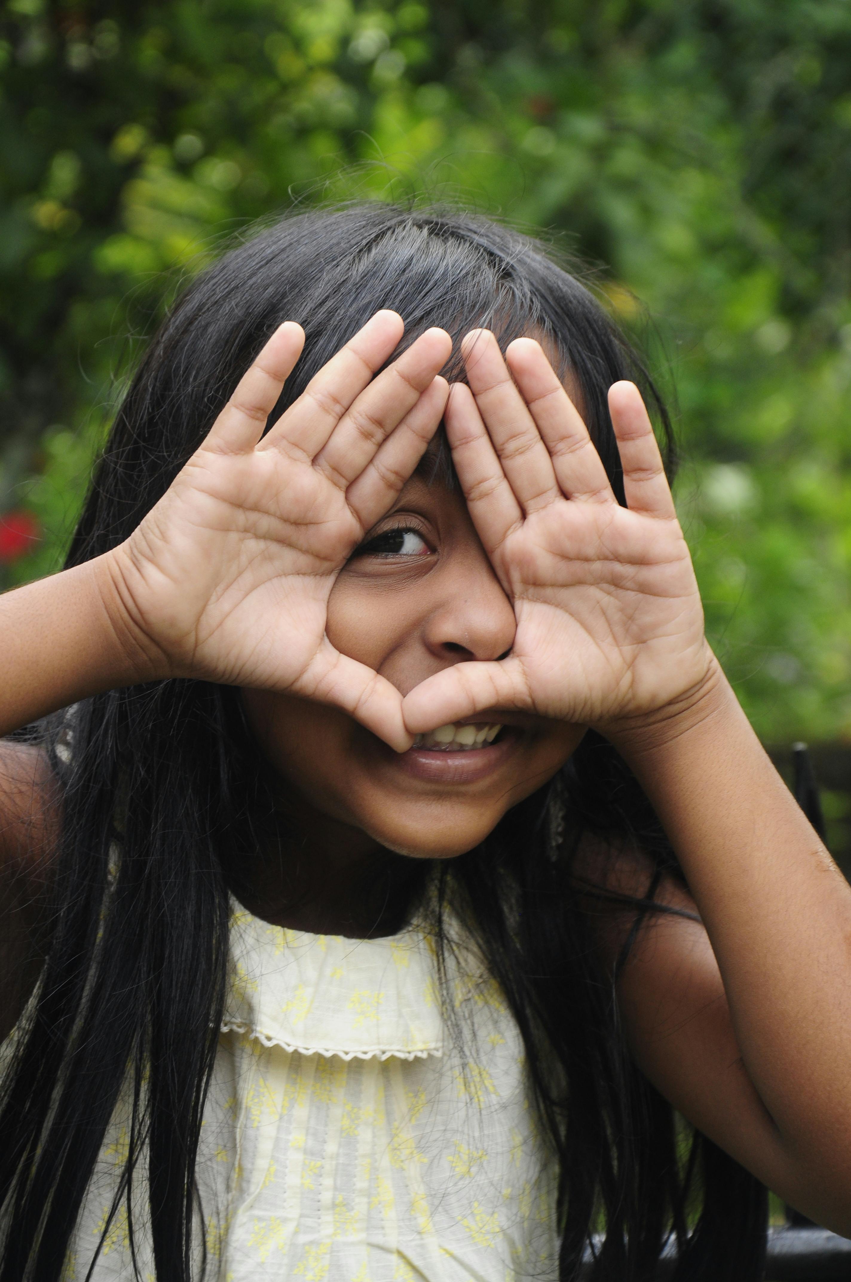 A Girl Covering Her Face with Her Hands · Free Stock Photo
