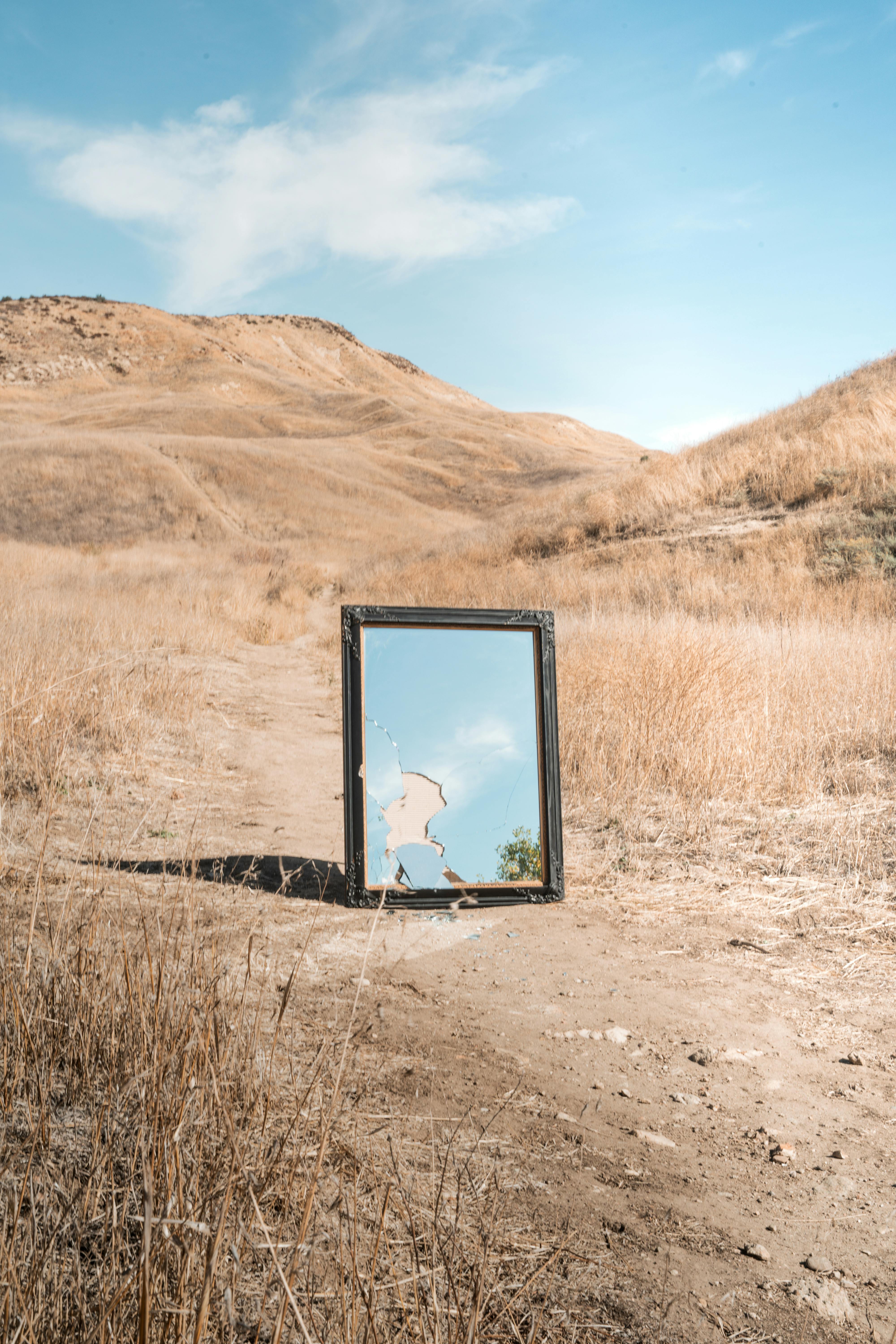 A Broken Mirror on the Dry Ground · Free Stock Photo