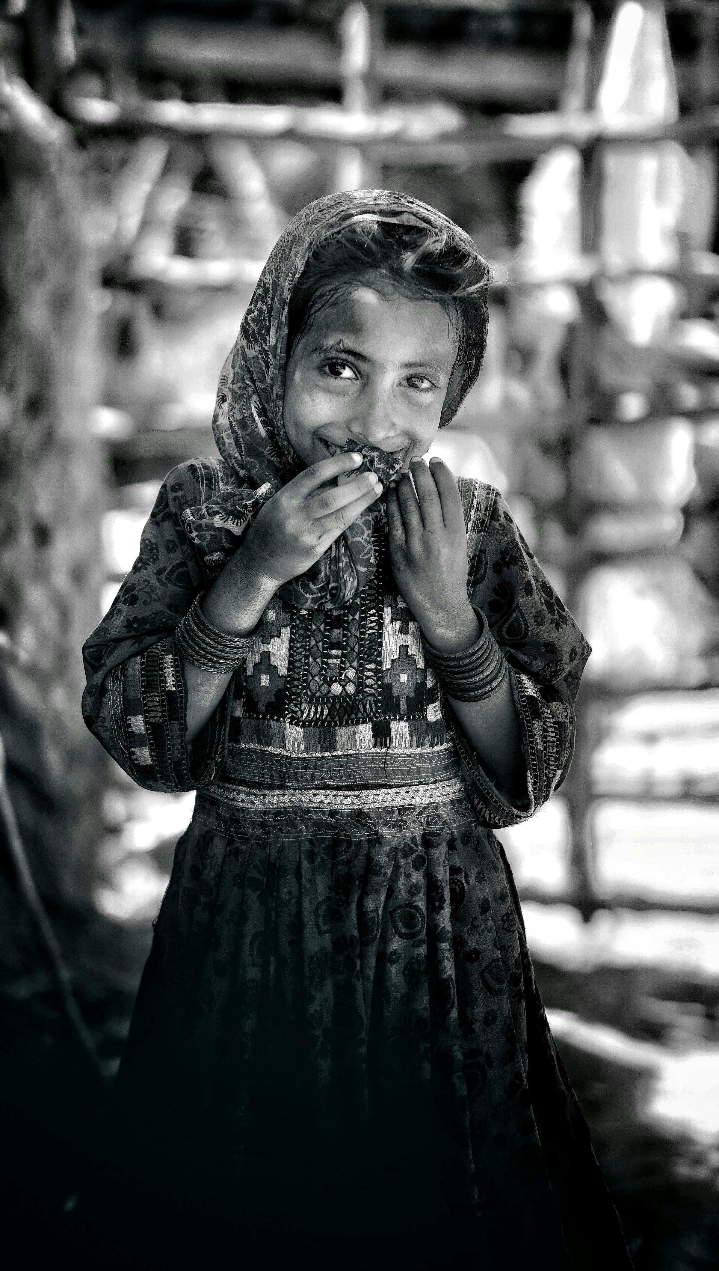 Girl Standing and Smelling Fruit from Tree · Free Stock Photo