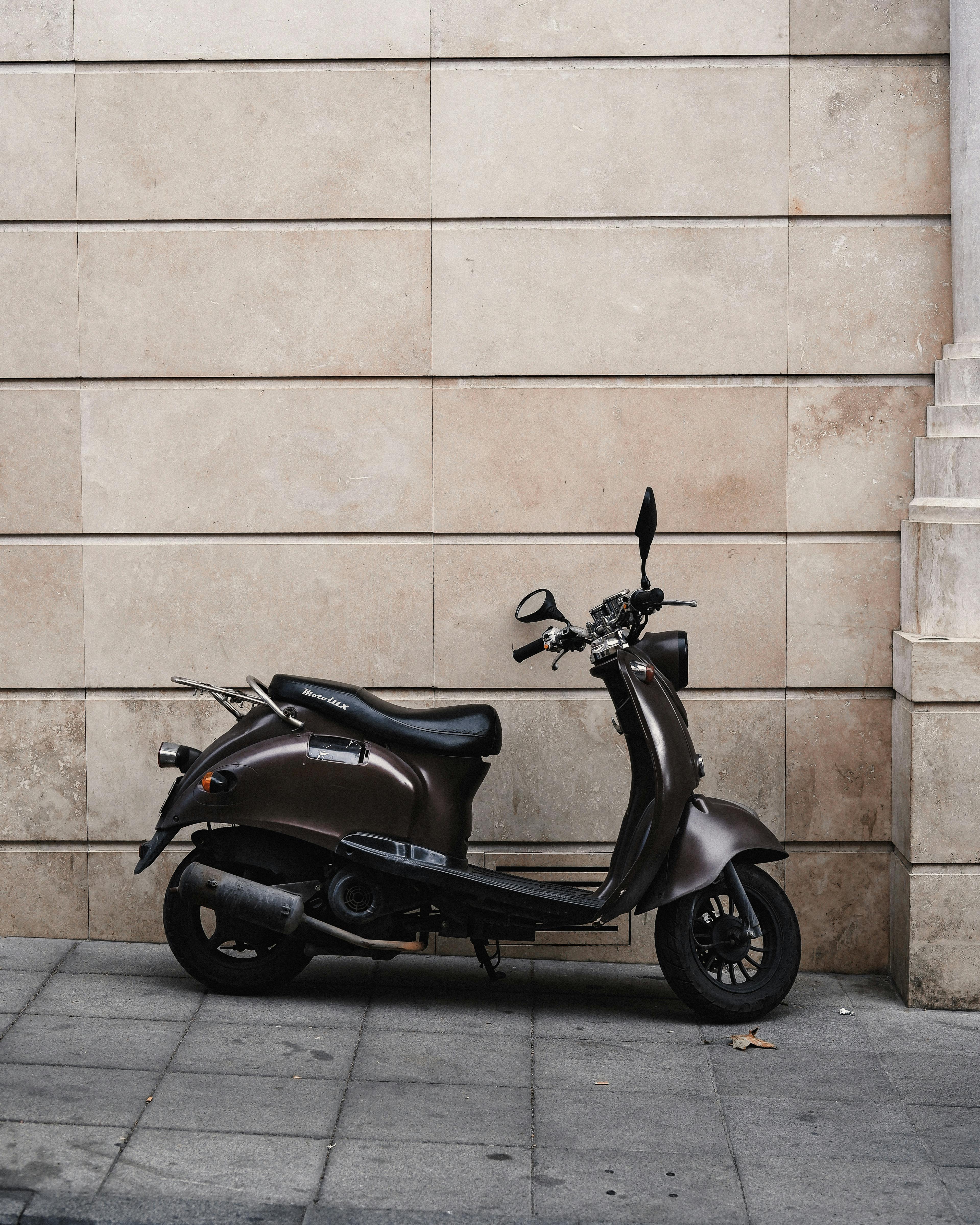 Parked Black Scooter on Sidewalk · Free Stock Photo