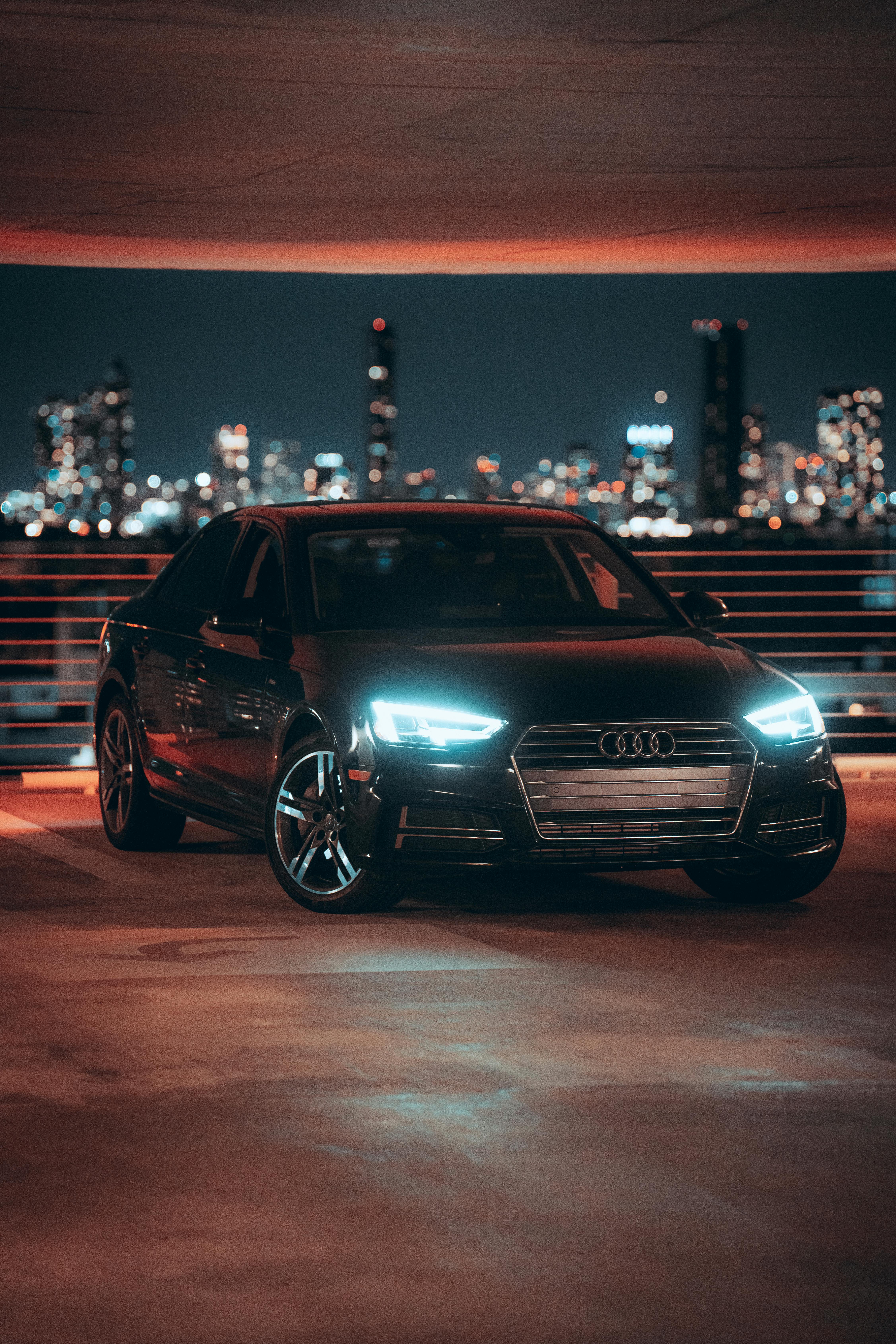 Black Car Parked on a Concrete Floor · Free Stock Photo