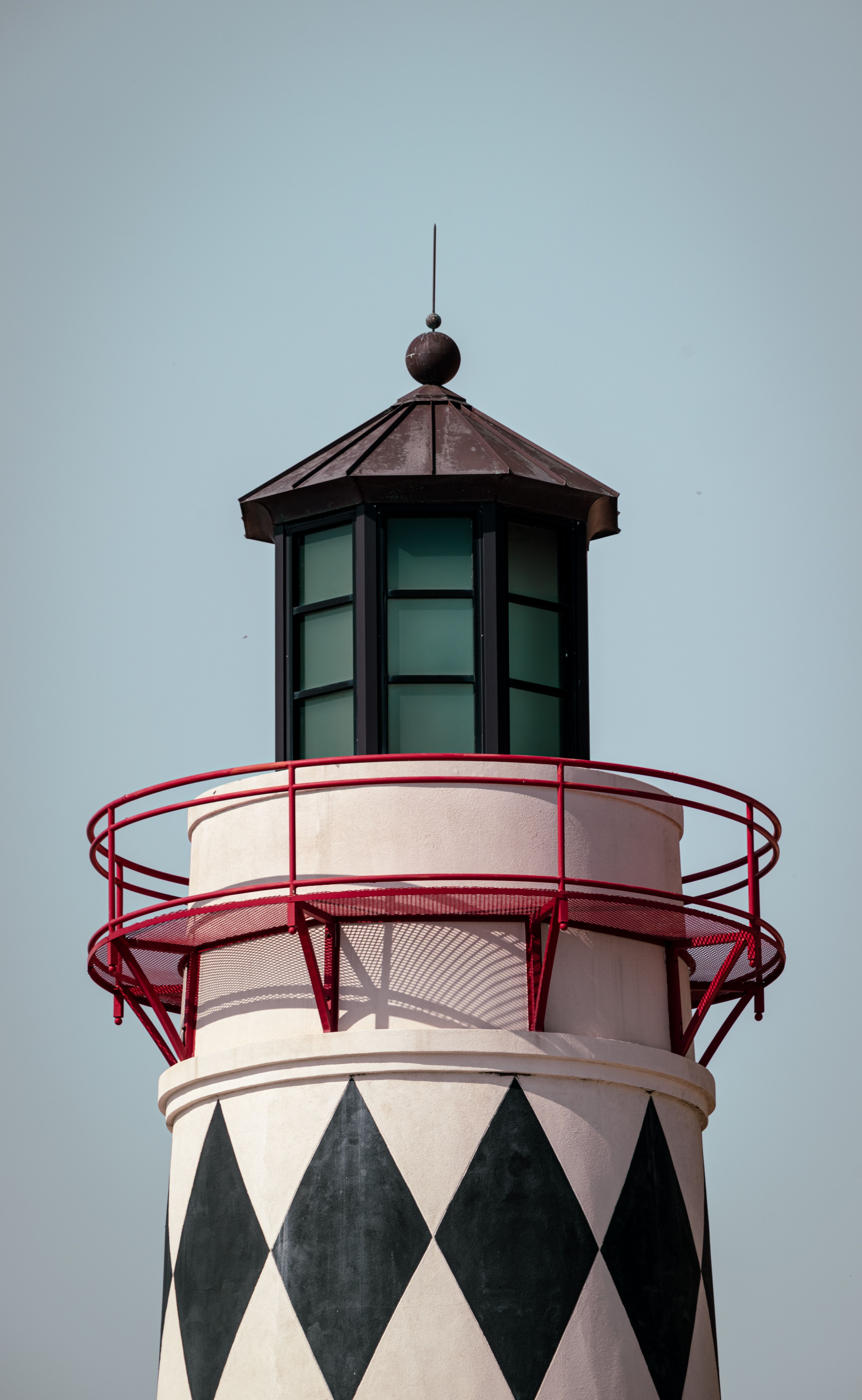 Red and White Lighthouse Under Blue Sky · Free Stock Photo
