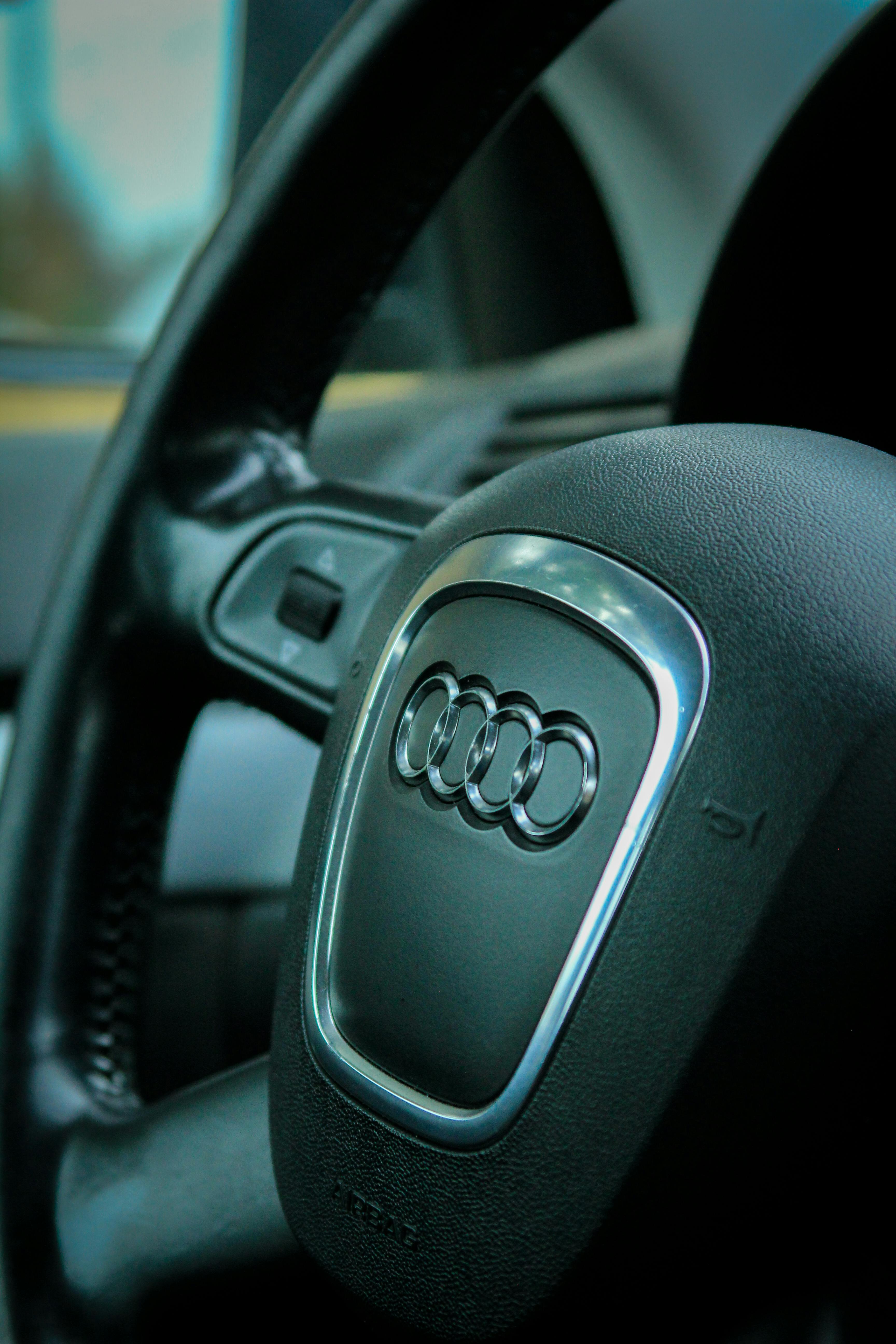 Audi Emblem on the Steering Wheel · Free Stock Photo