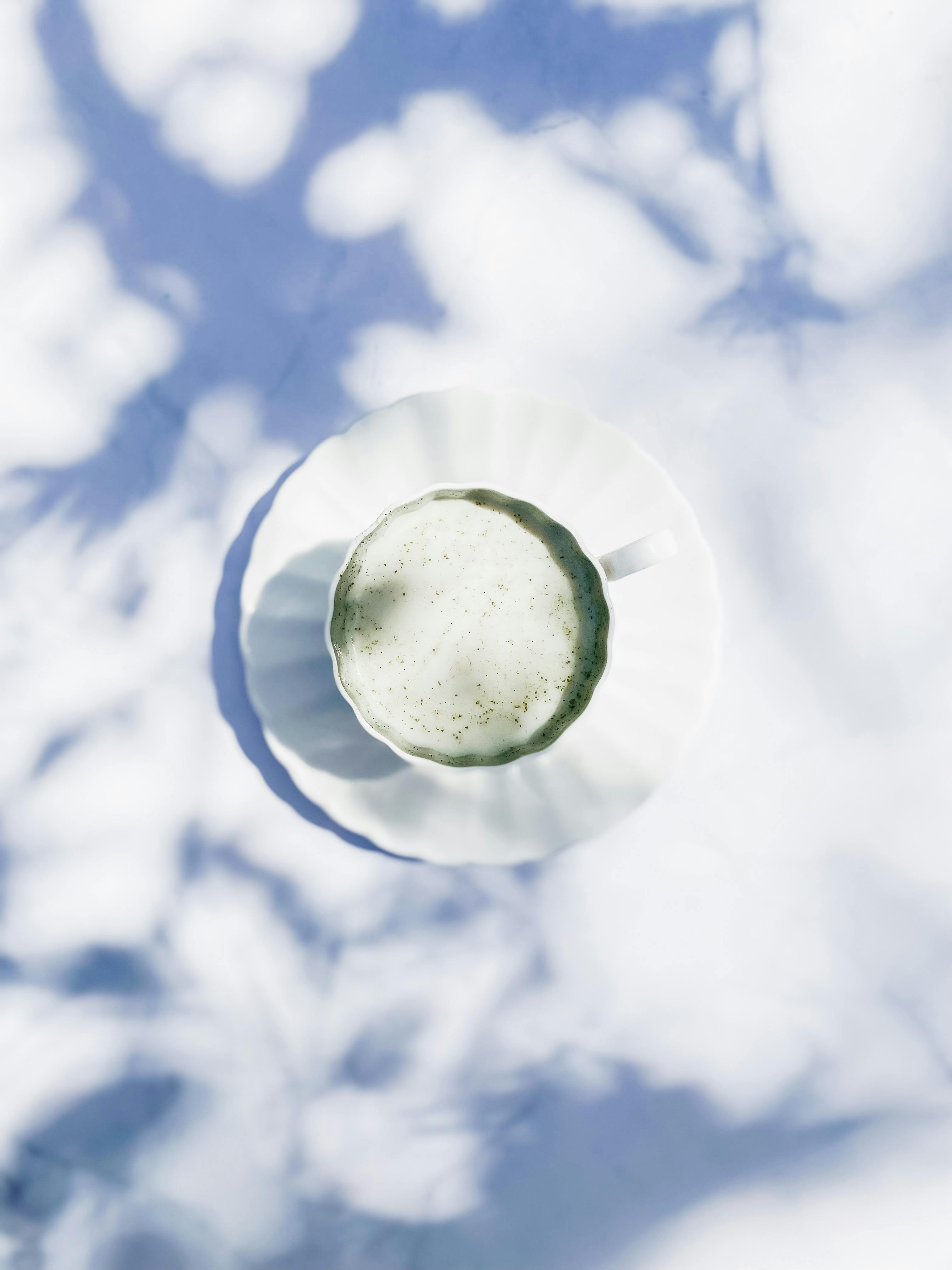 Spon on Coffee Cup · Free Stock Photo