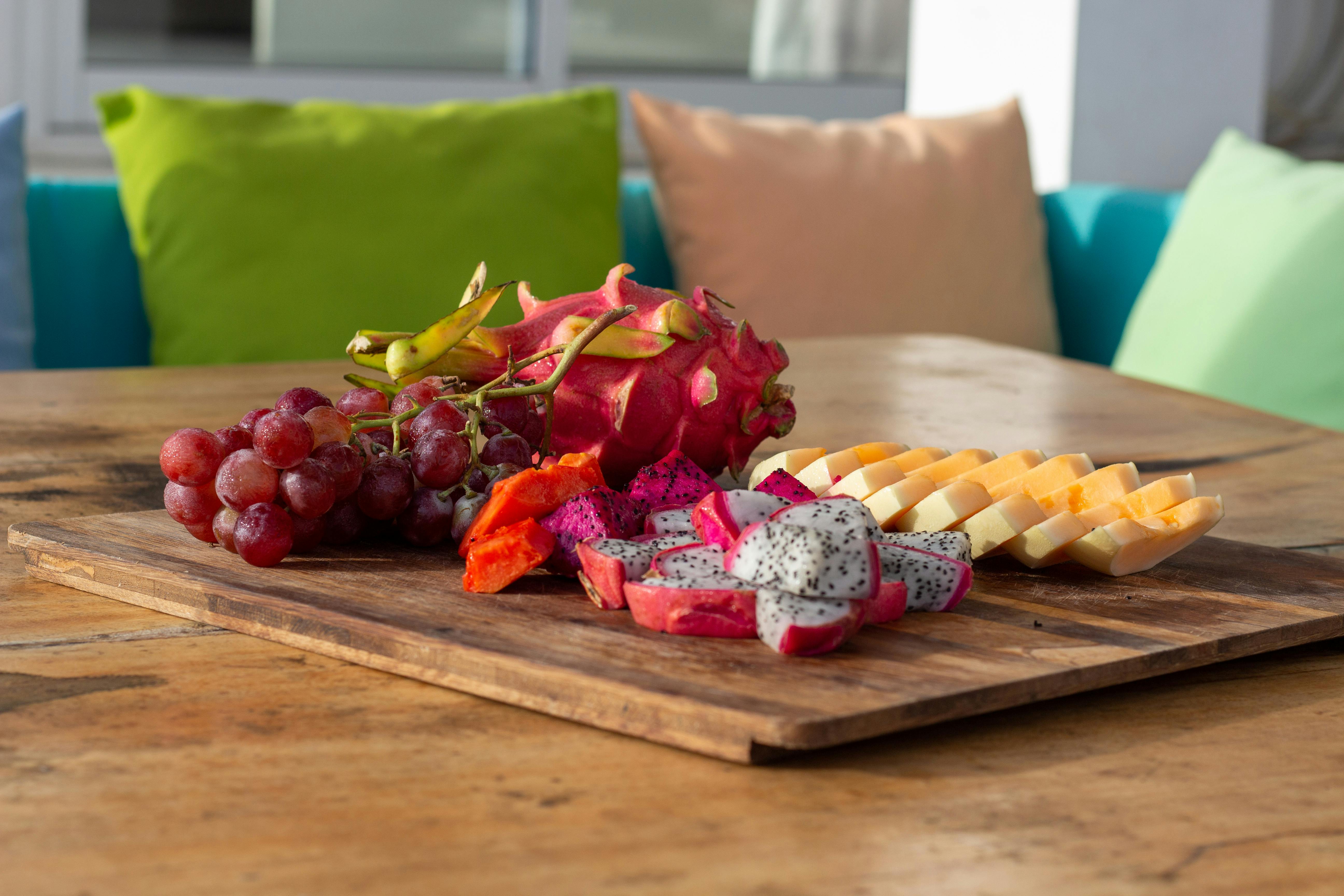Photo of Fruits on Wooden Chopping Board · Free Stock Photo
