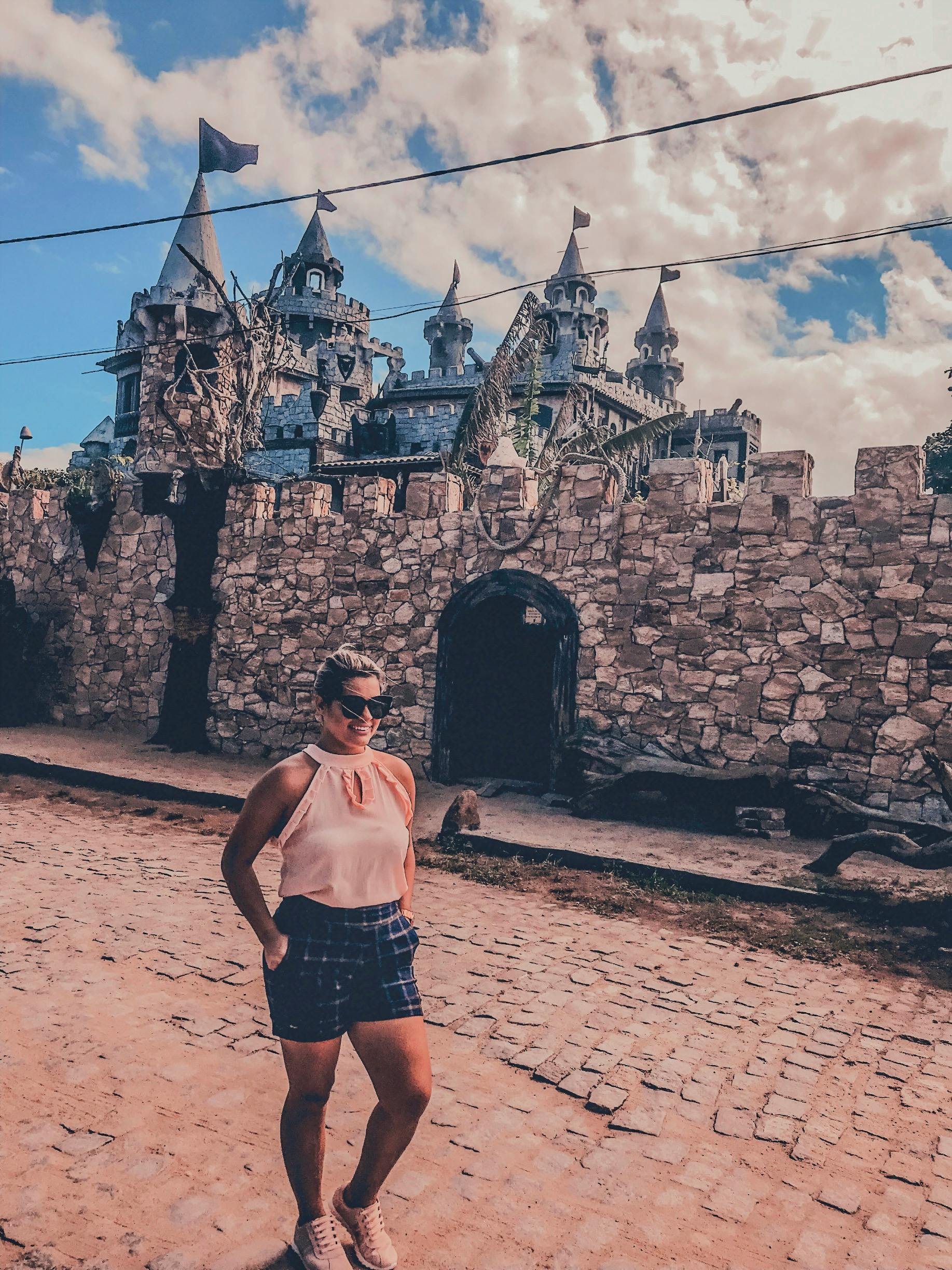 Woman Sitting on Ledge · Free Stock Photo