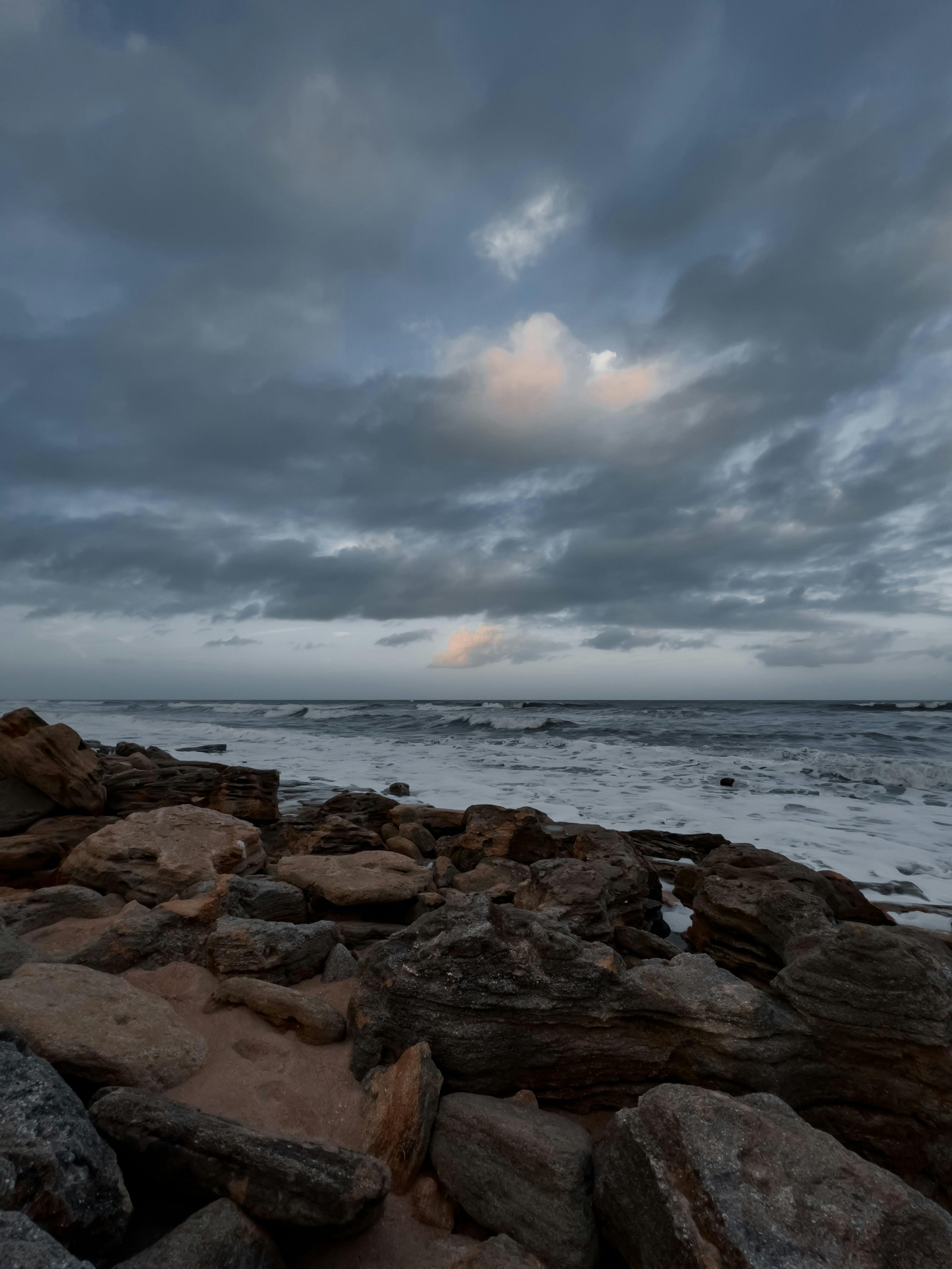 Photograph of Rocks near an Ocean · Free Stock Photo