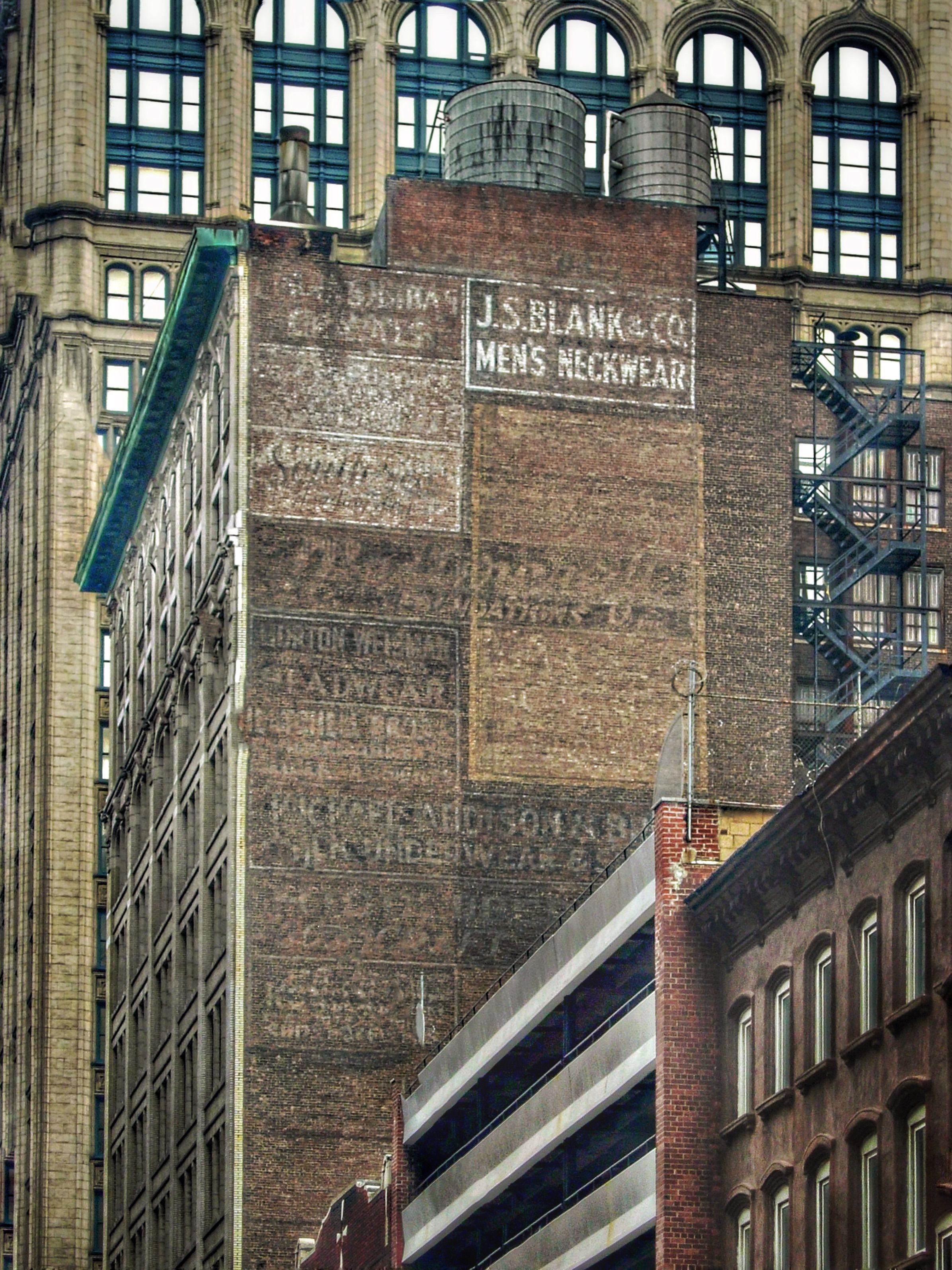 Ghost Signs on Building Wall · Free Stock Photo