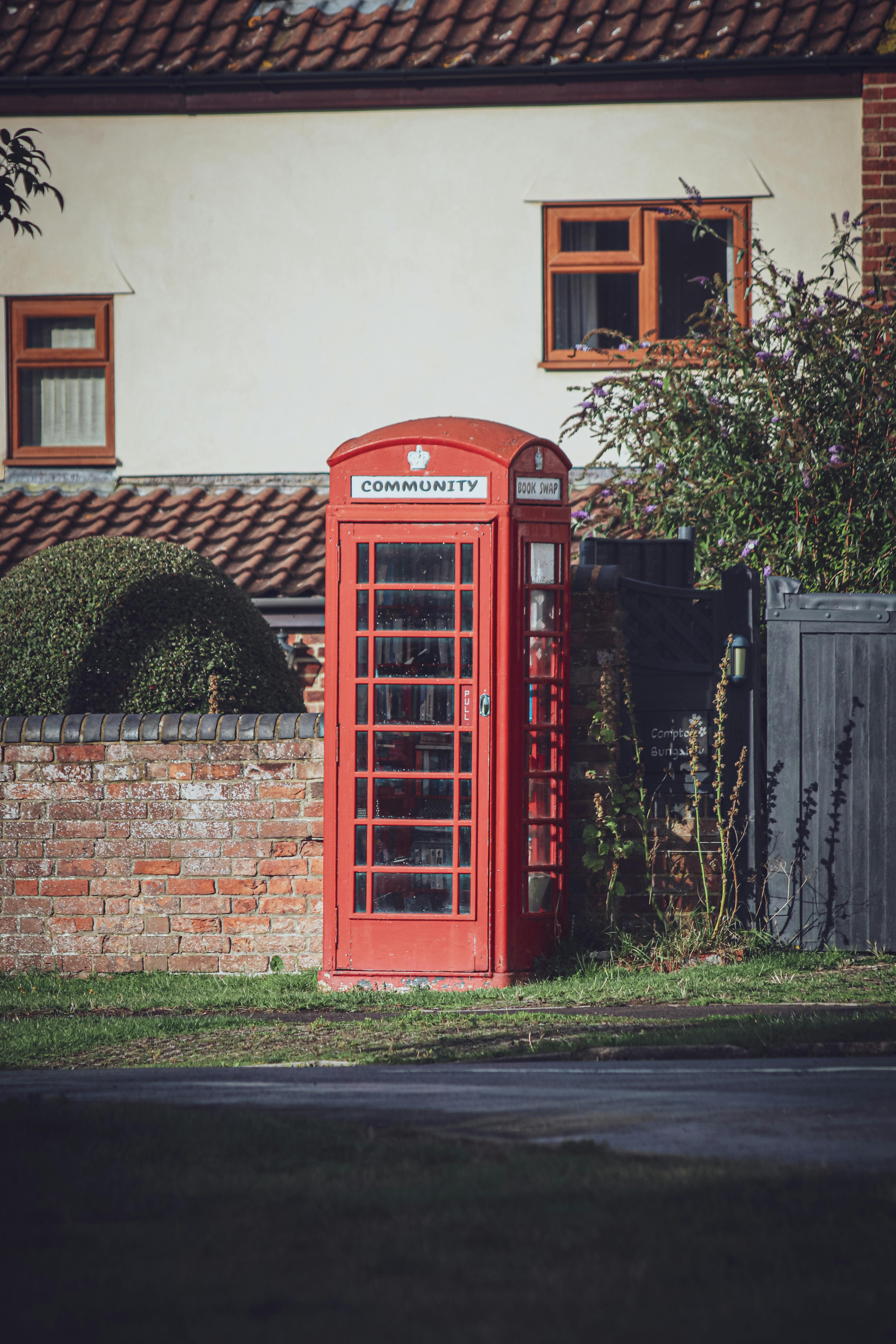 Maroon Push Button Telephone on Table · Free Stock Photo