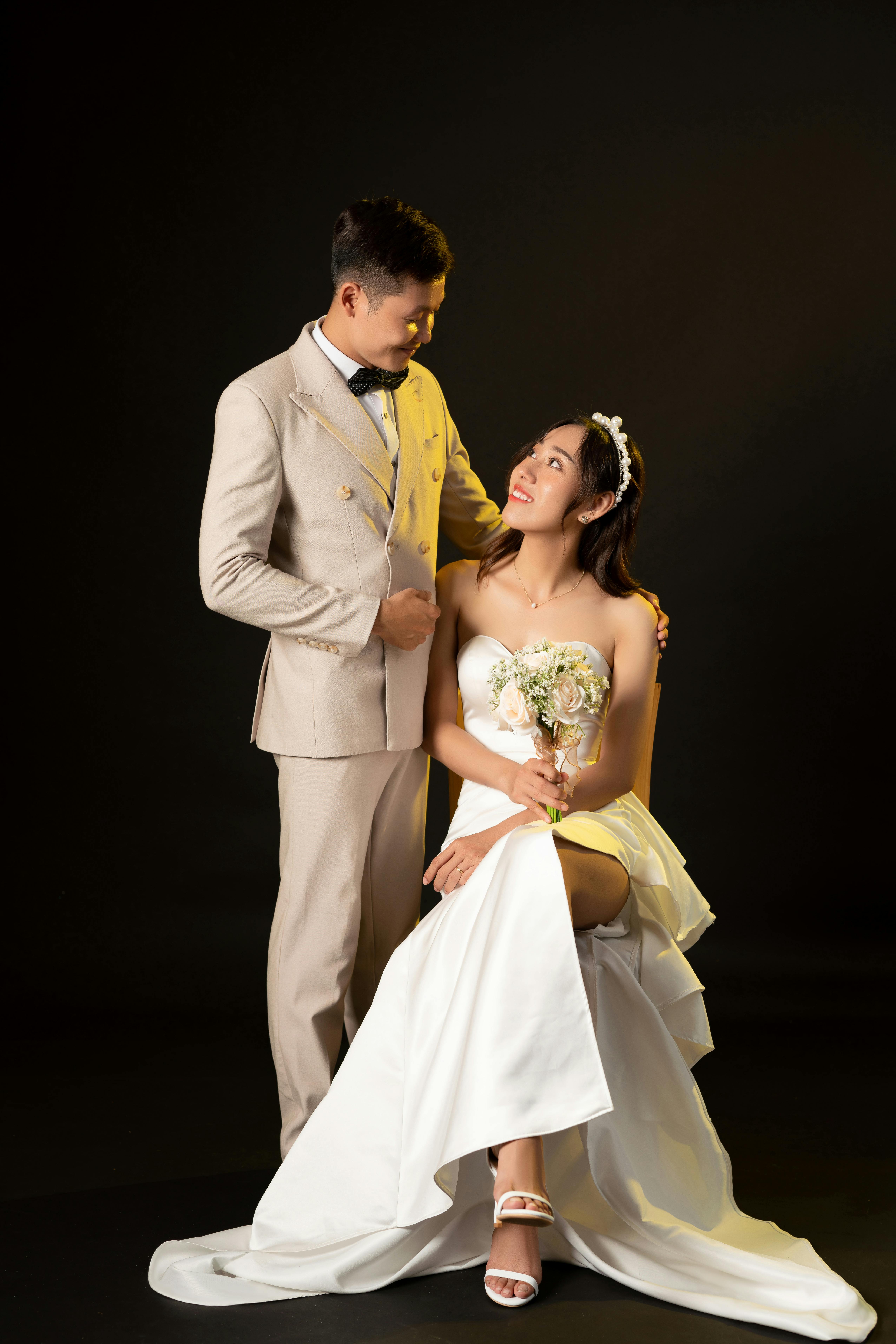 A Bride and a Groom Looking at Each Other · Free Stock Photo
