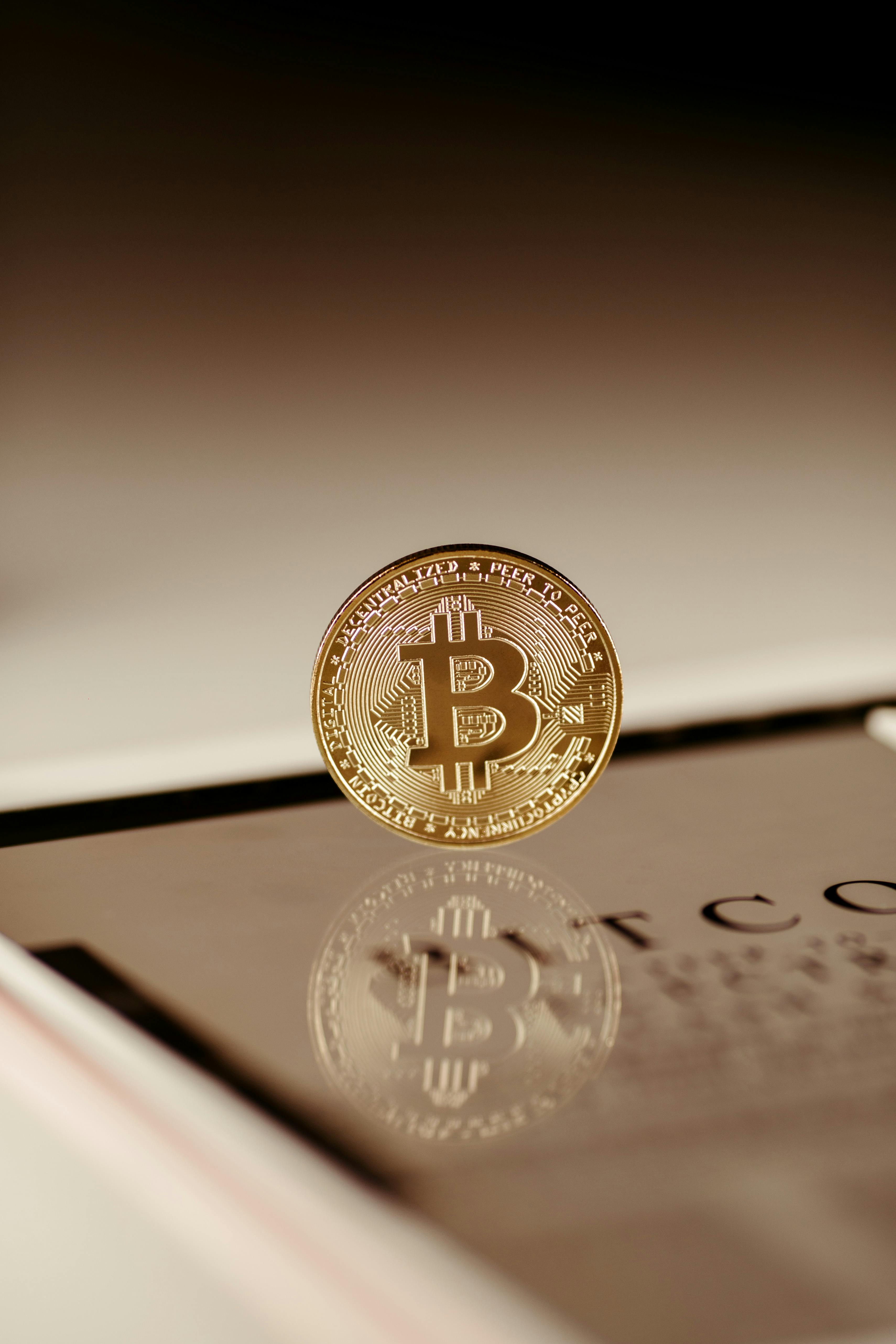 Gold Coin on Top of Digital Tablet · Free Stock Photo