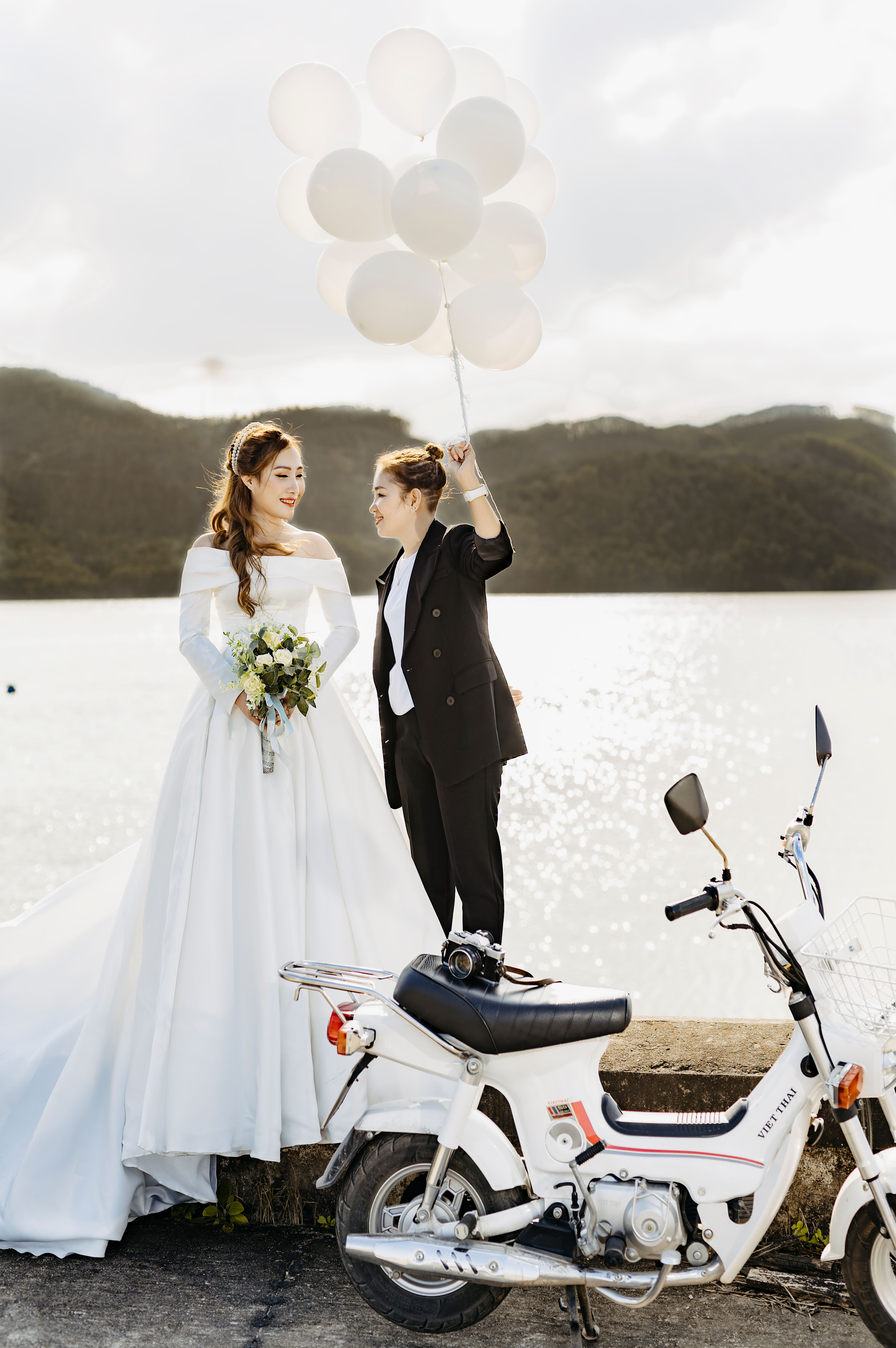 Women Together in Wedding Dress ad Suit · Free Stock Photo