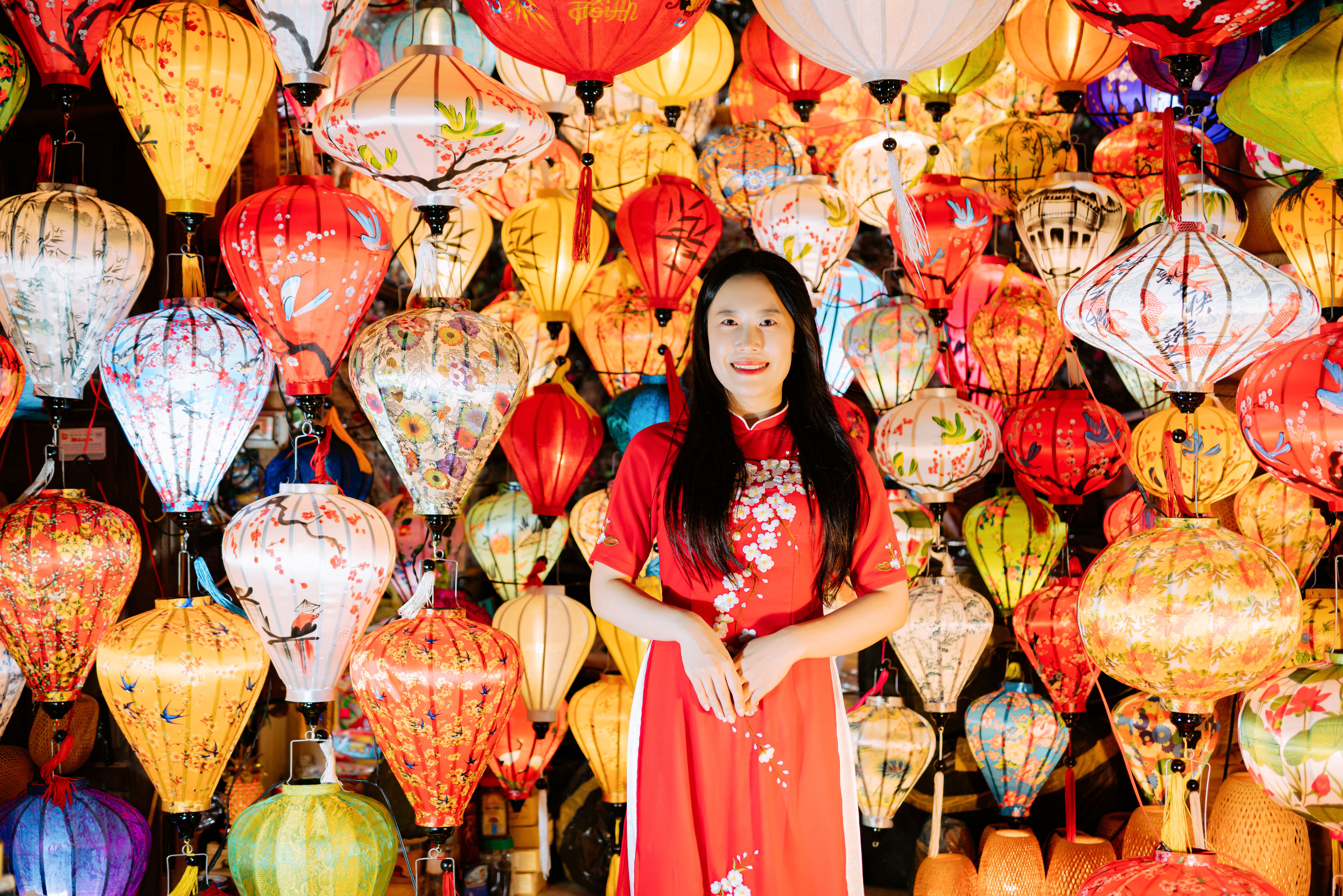 A Woman in a Red Dress Near Colorful Lanterns · Free Stock Photo